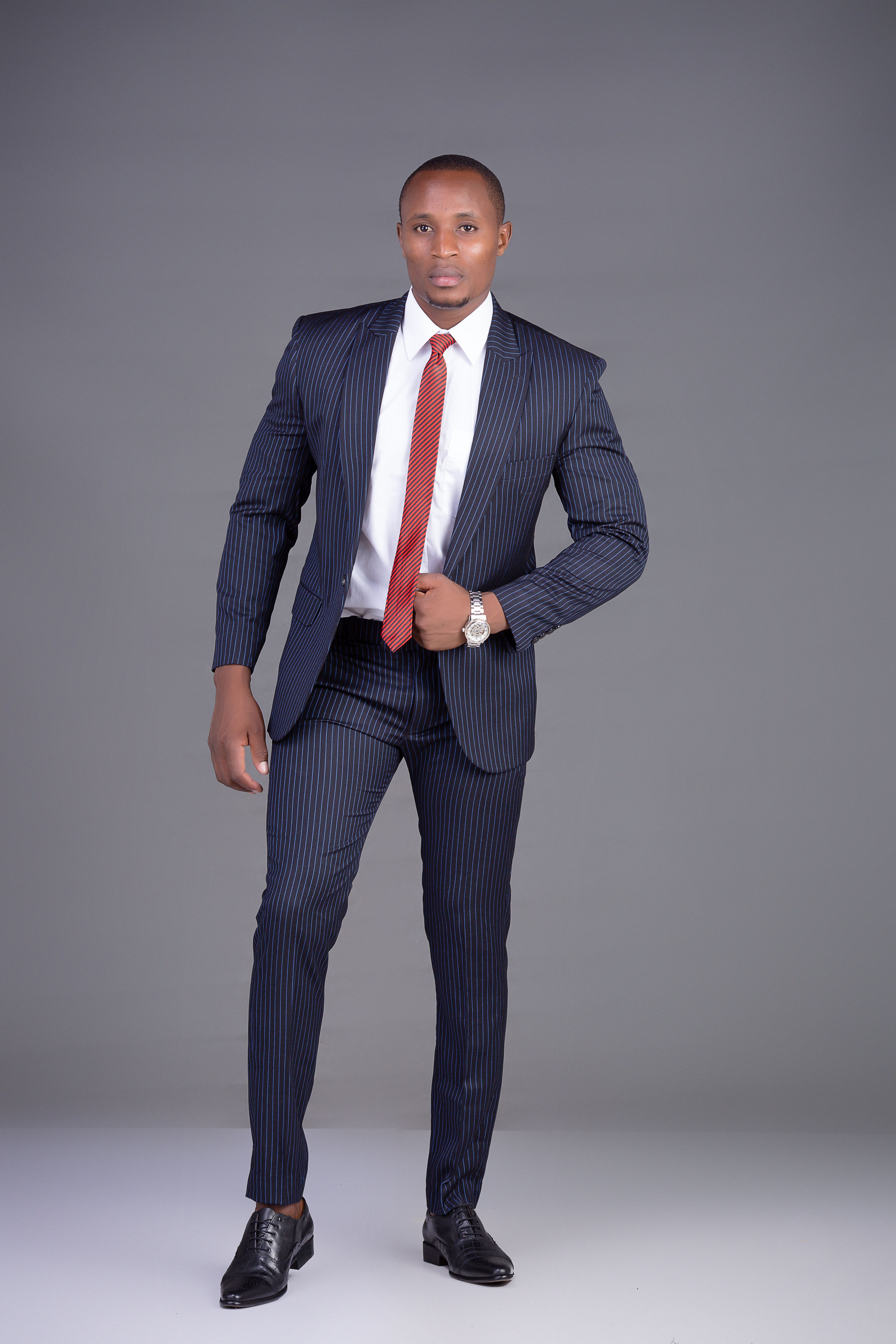 Man in Black Suit Standing Firm while Looking Afar · Free Stock Photo