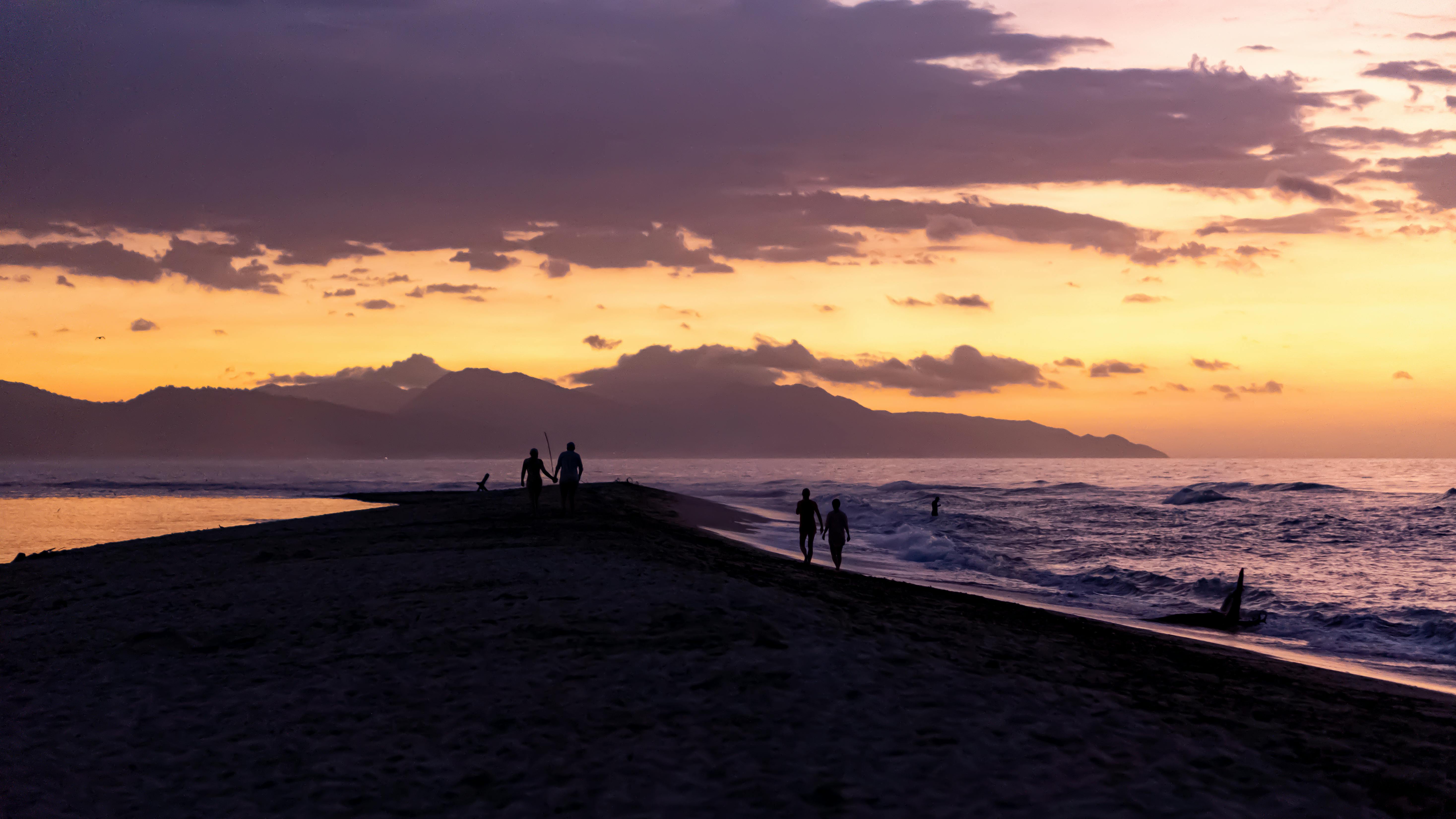 People Walking on the Shore of the Beach Under Evening Sky · Free Stock ...