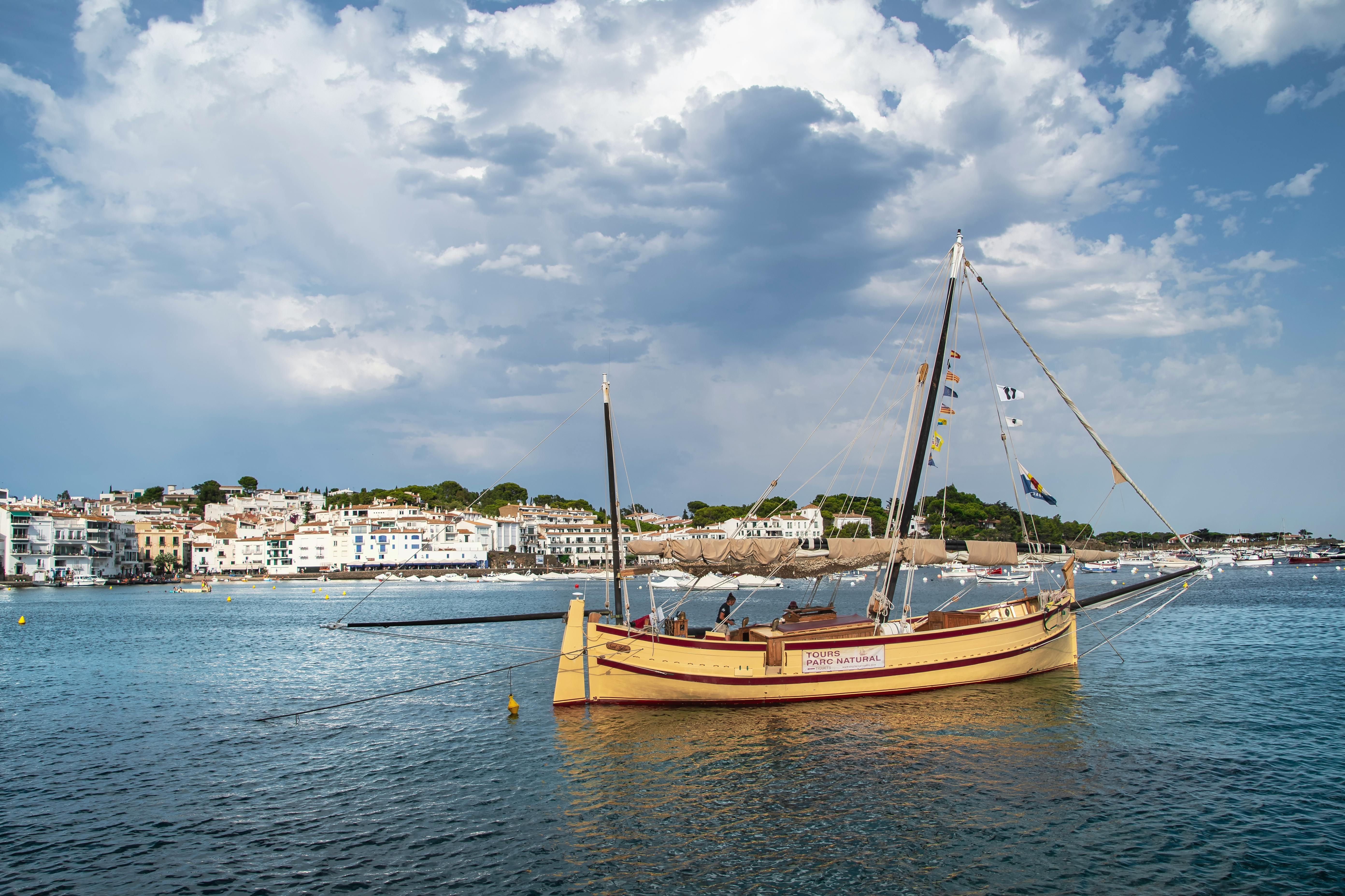 Brown Boat on Body of Water · Free Stock Photo