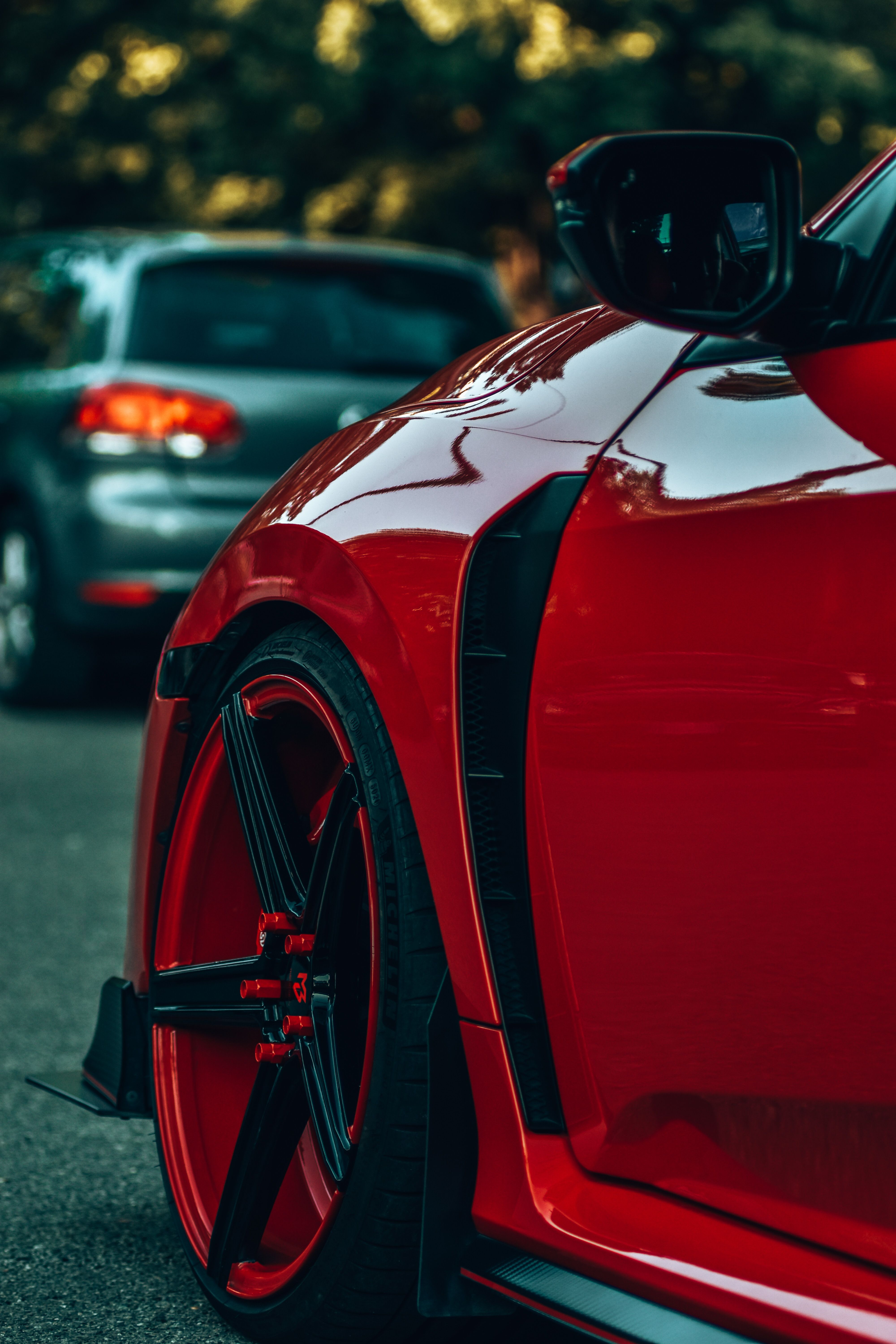 Red Car on Gray Asphalt Road · Free Stock Photo