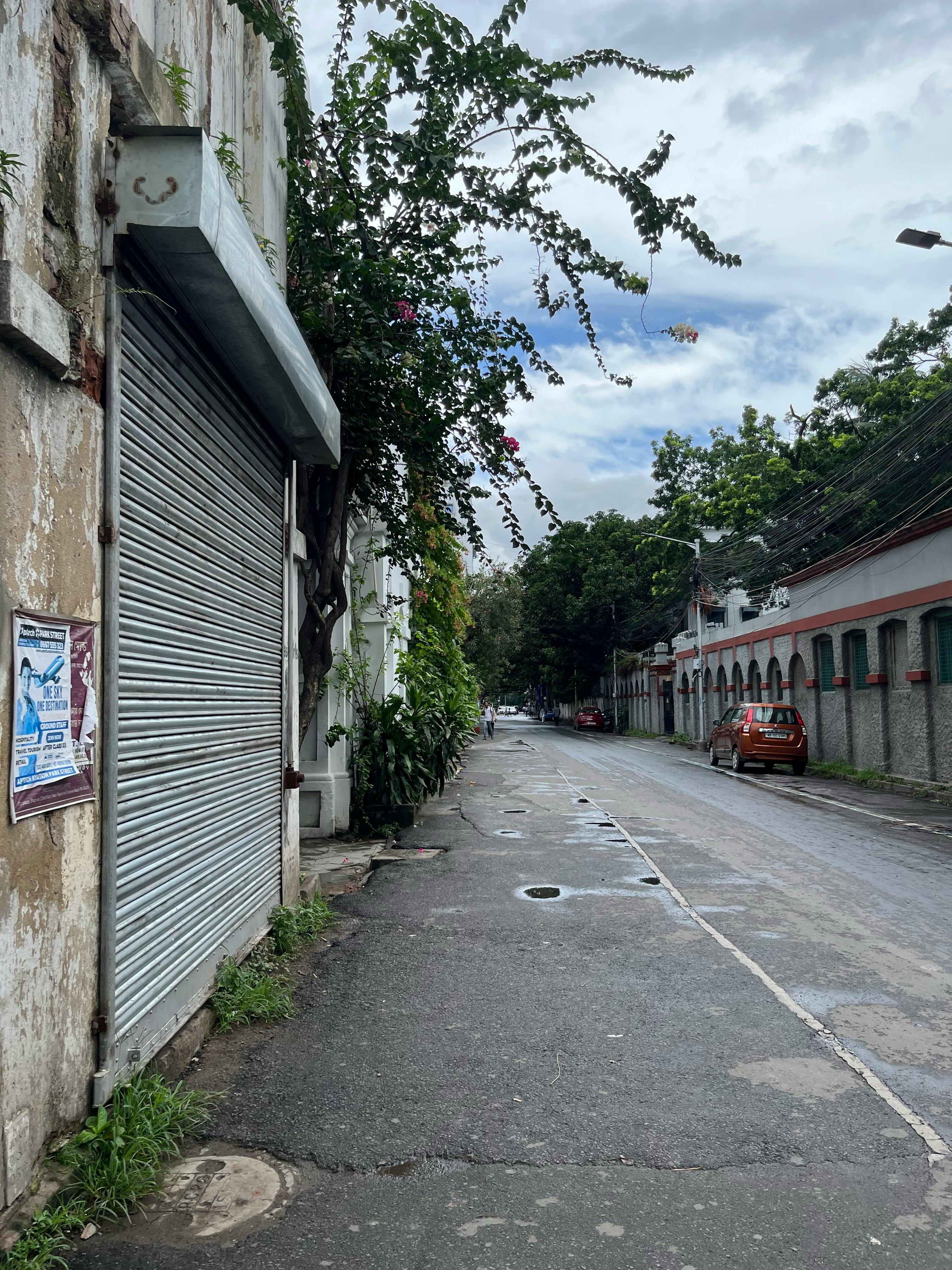 Empty Street Between Concrete Buildings · Free Stock Photo