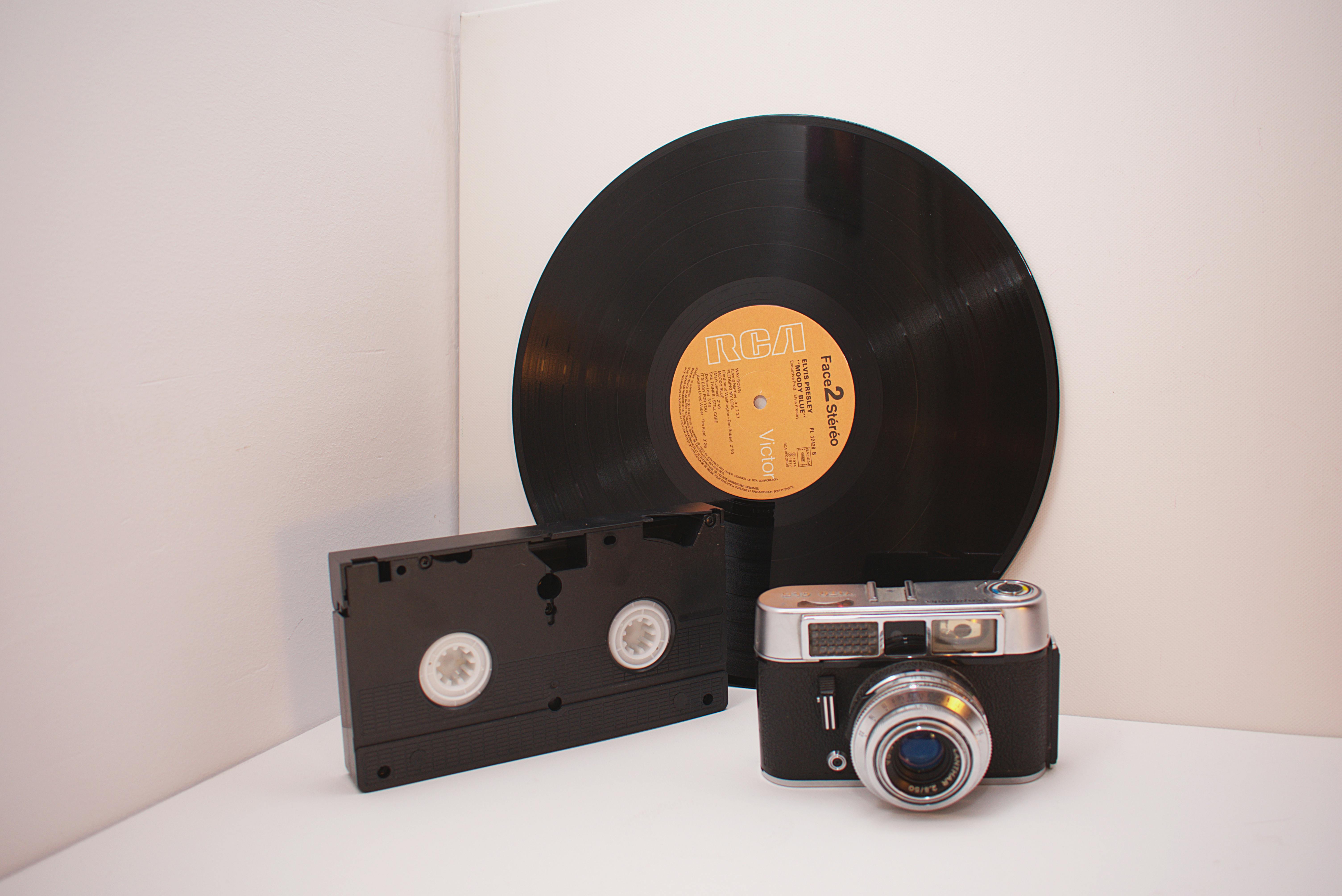 Black Vinyl Disc, Black Vhs Tape And Camera · Free Stock Photo