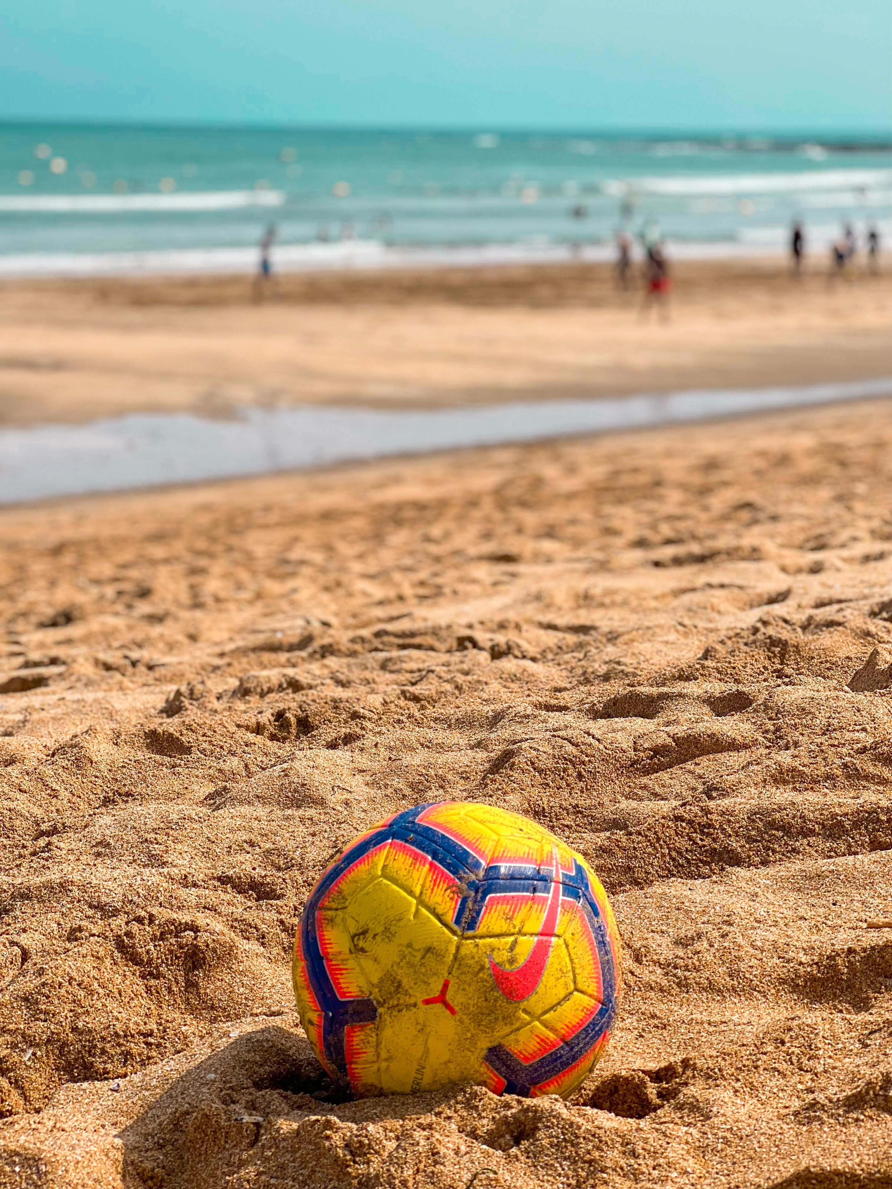 Man Playing Football on Beach · Free Stock Photo