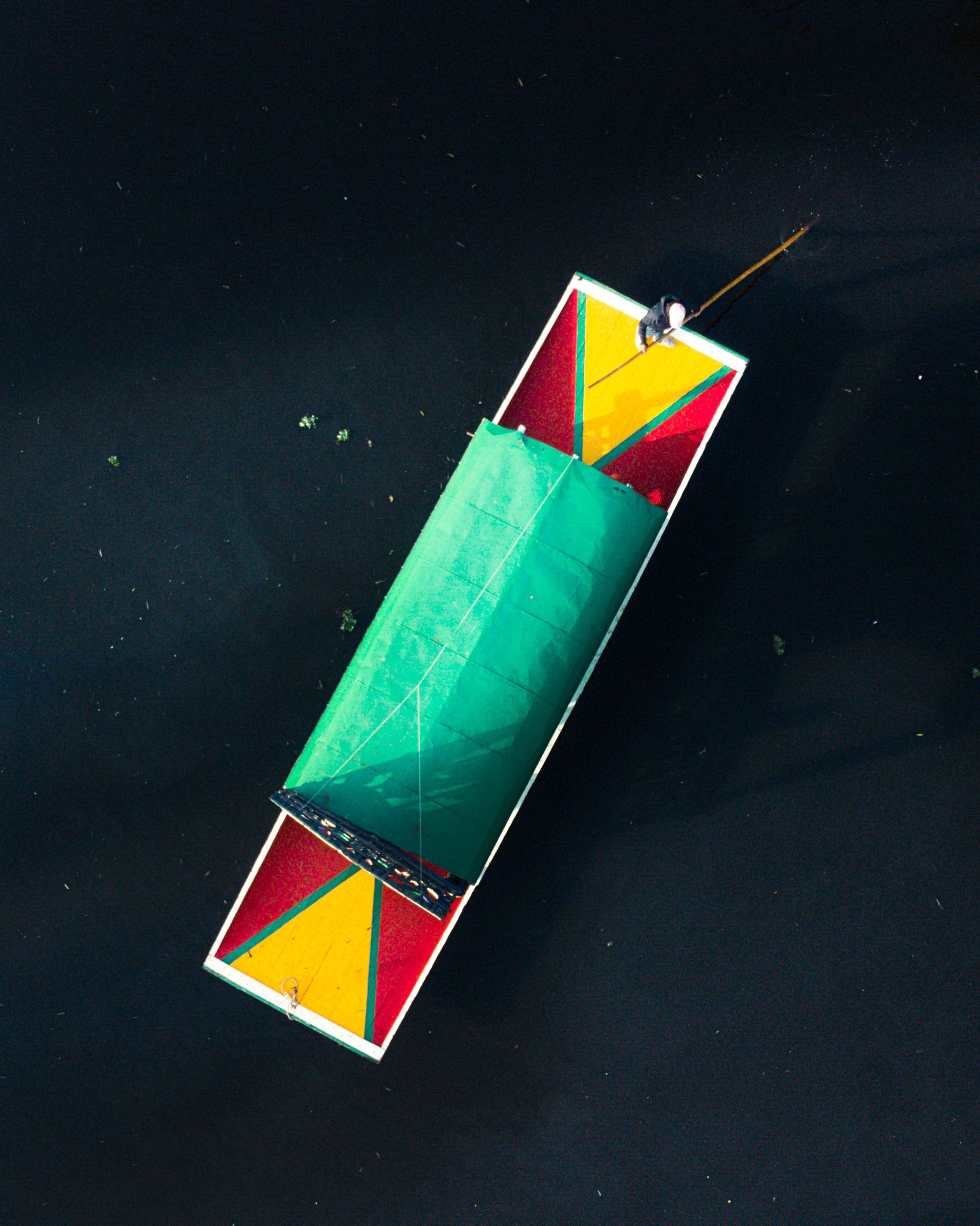 Aerial View of a Boat Sailing Through a Black Water · Free Stock Photo
