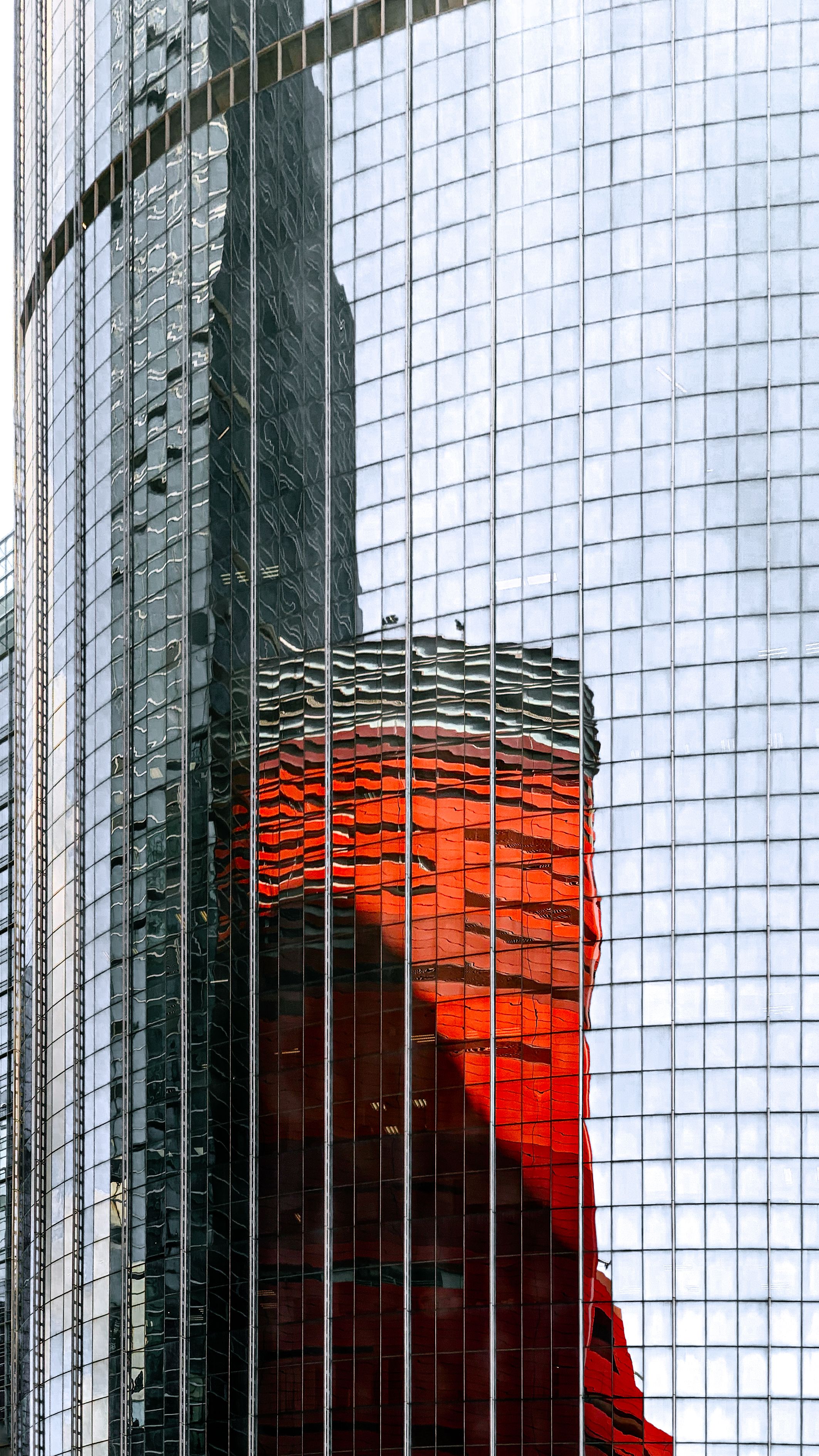 Reflection in Glass Wall of Building · Free Stock Photo
