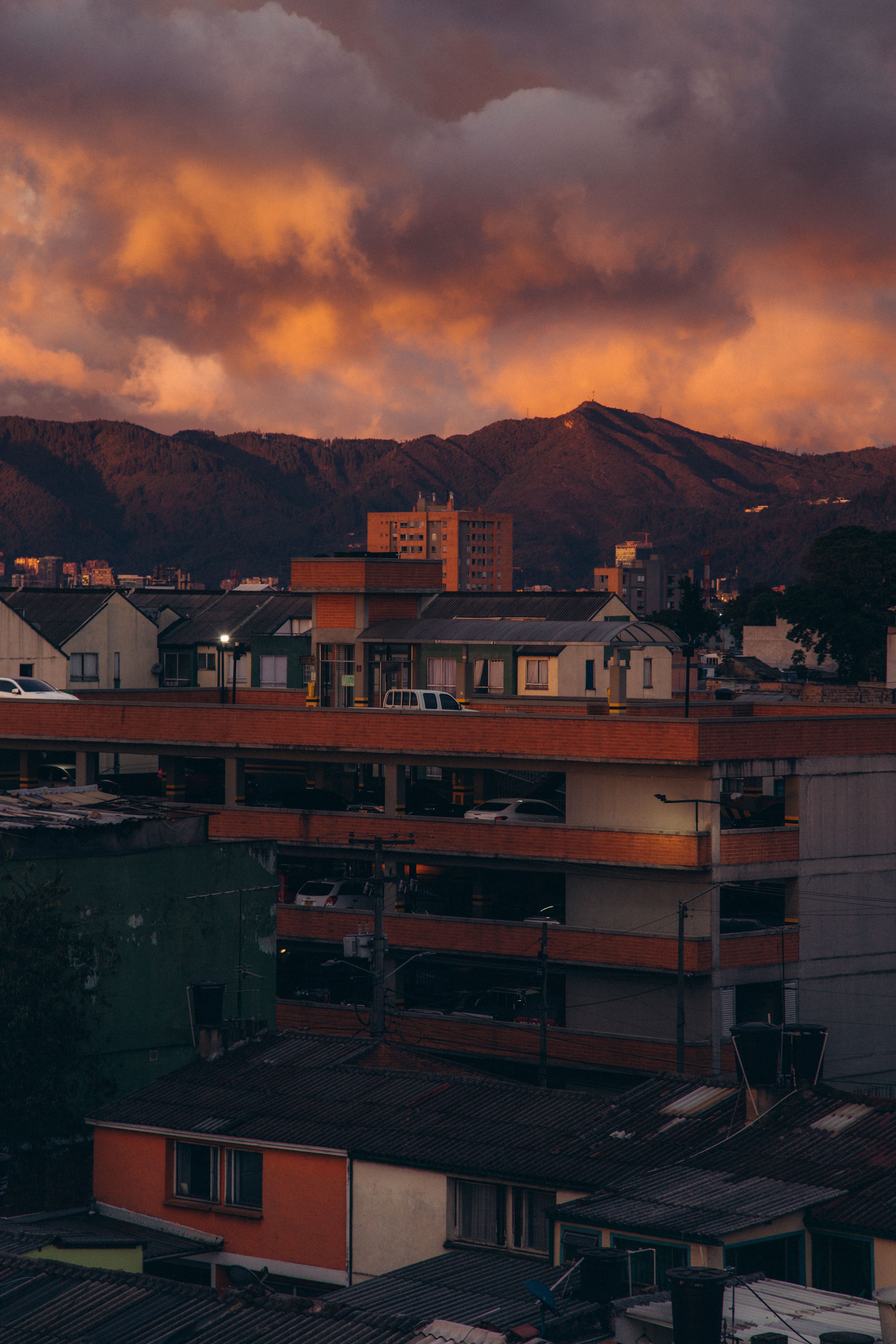 Cloudy Sky over a City at Sunset · Free Stock Photo