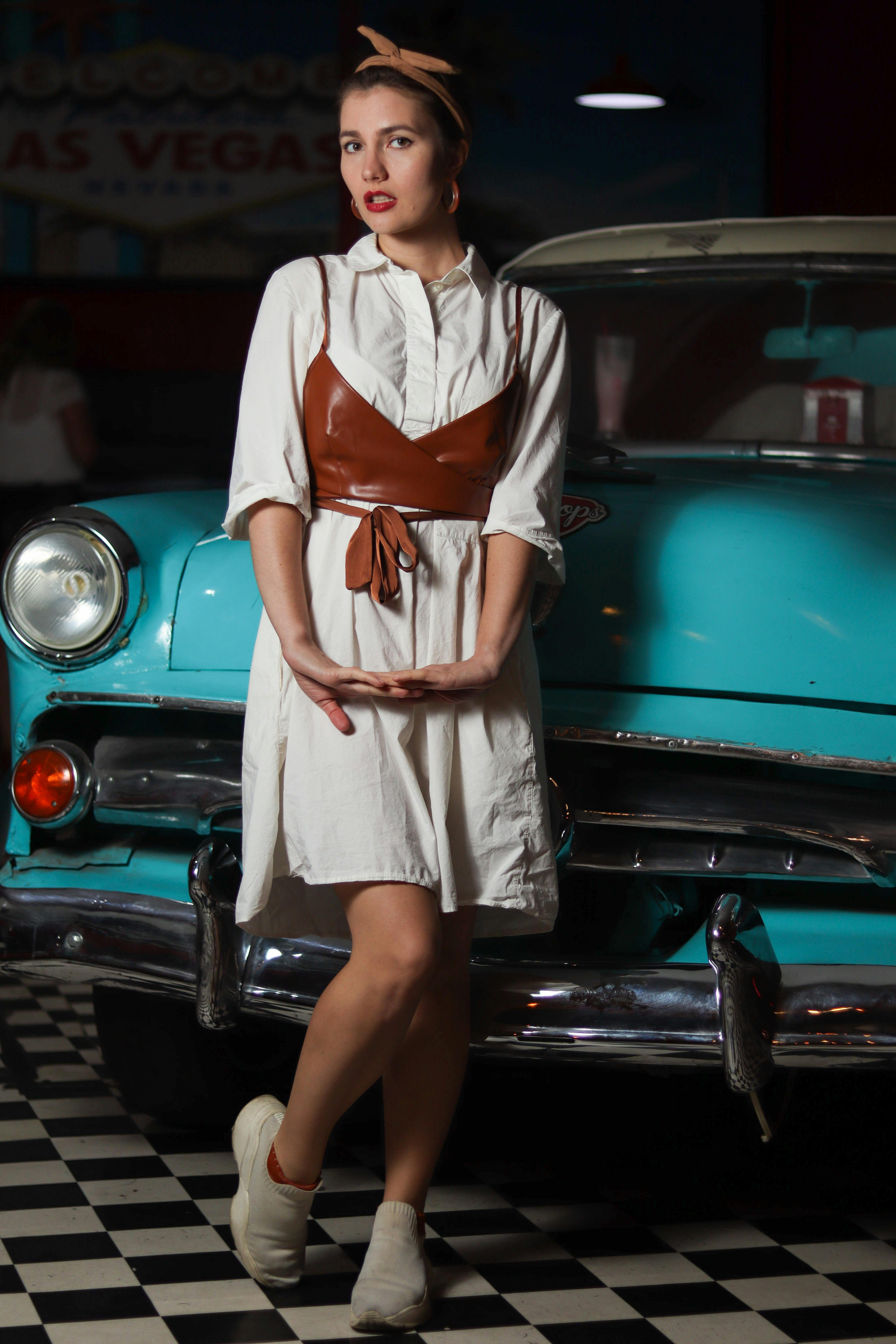 Woman Driving Vintage Car on Road during Daytime · Free Stock Photo