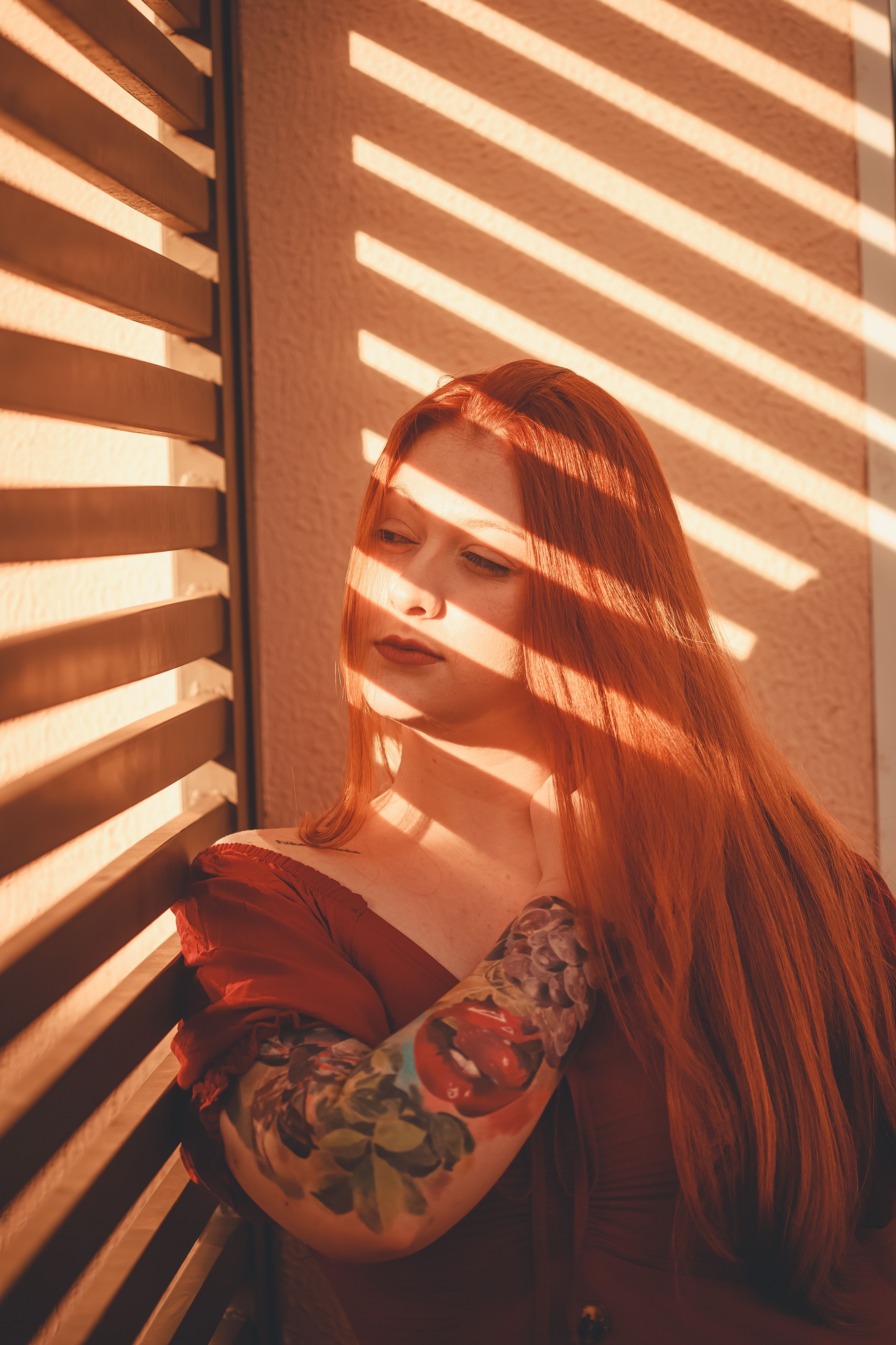 Woman Standing Beside a Window · Free Stock Photo