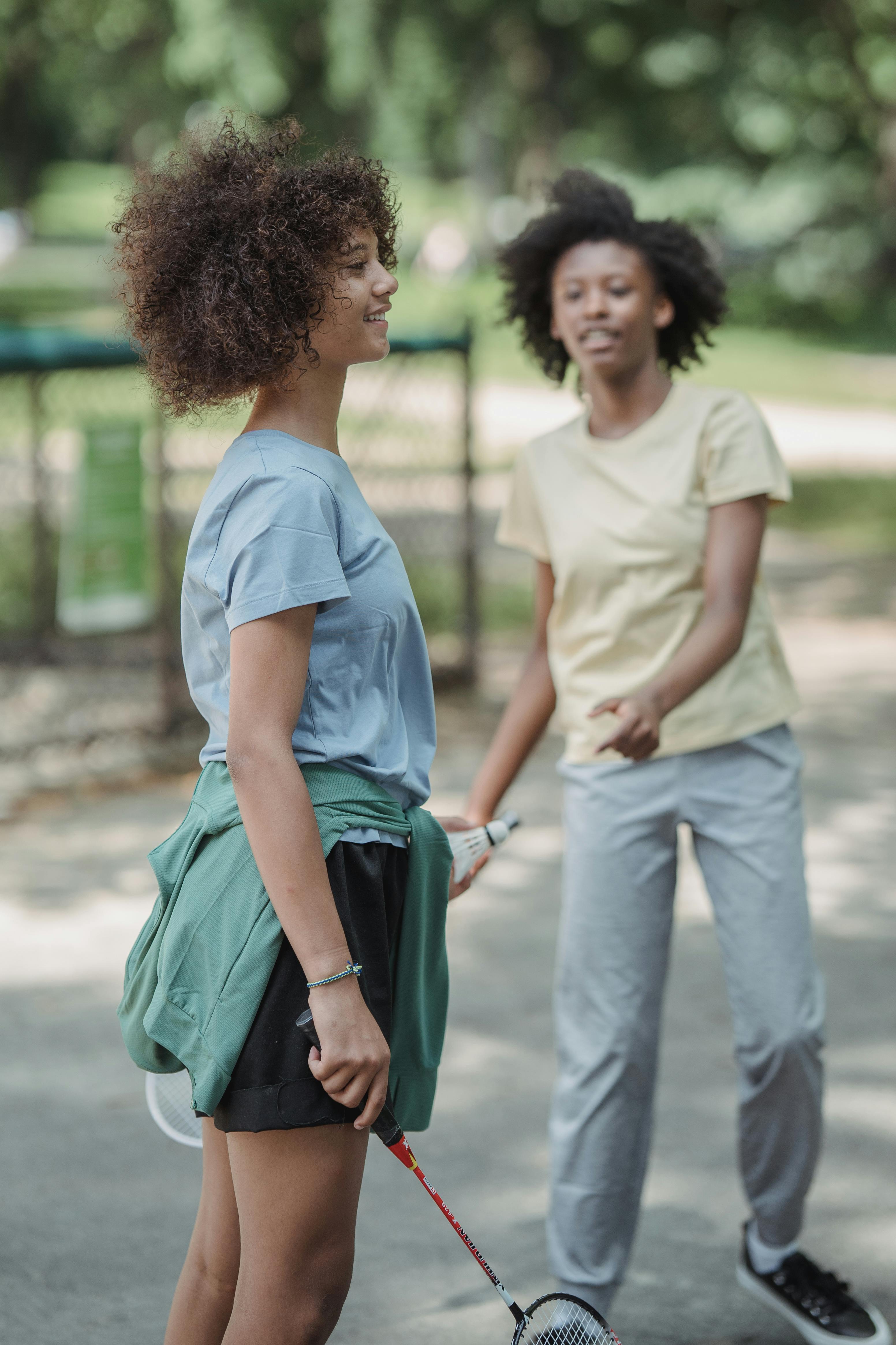 Women Holding Badminton Rackets · Free Stock Photo