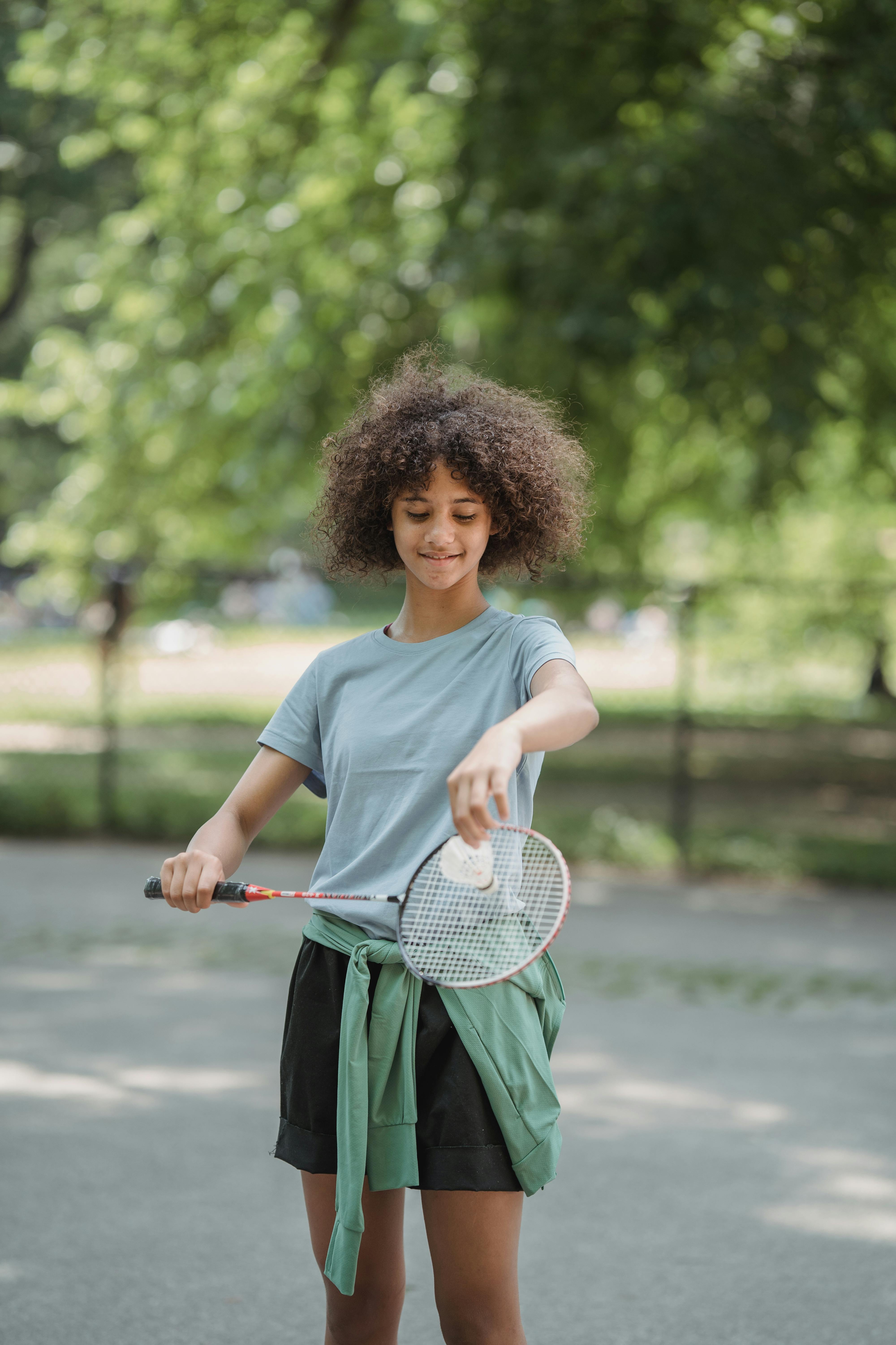 Teenage Girl Playing Badminton · Free Stock Photo