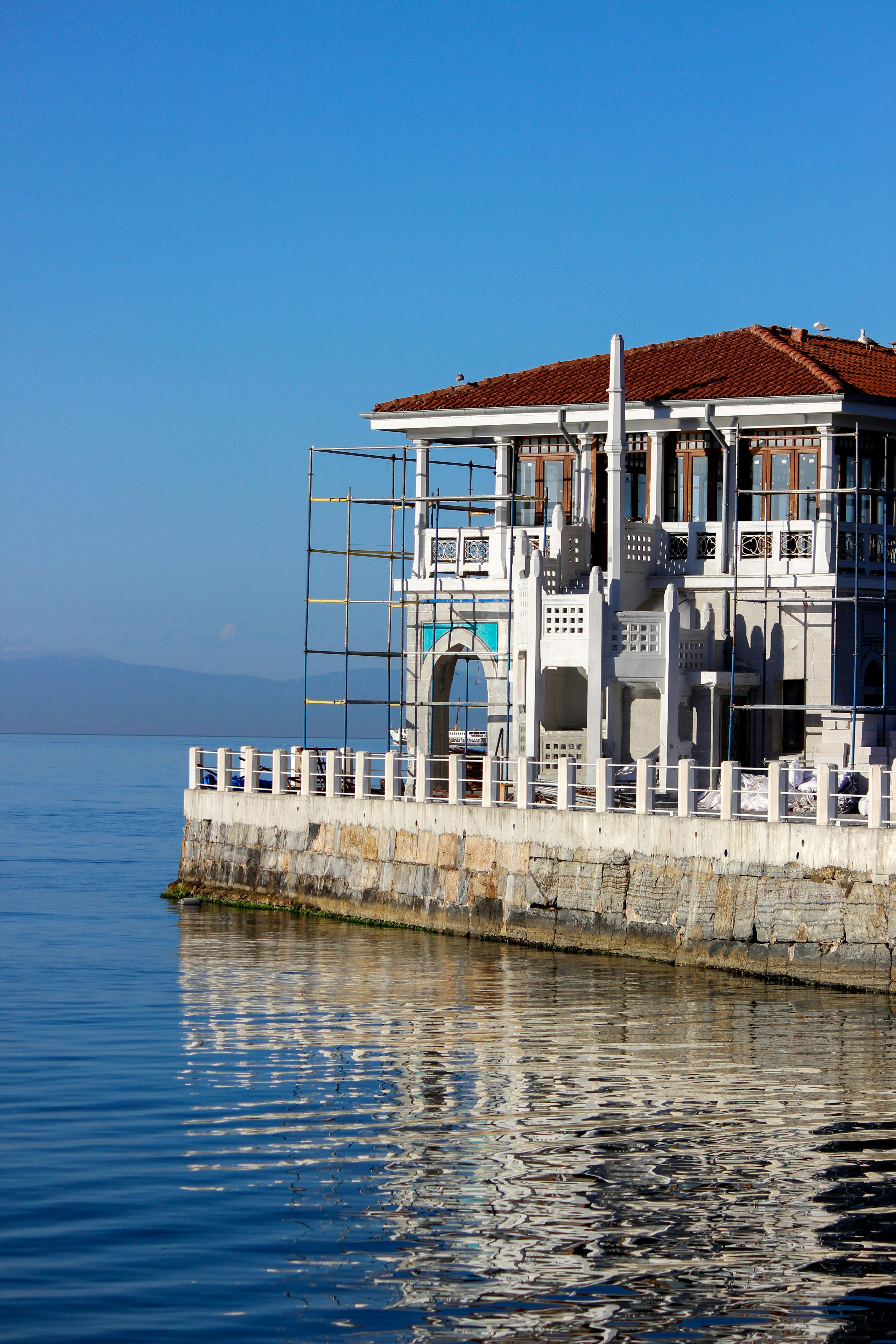 Seaside Building Surrounded by Scaffoldings · Free Stock Photo