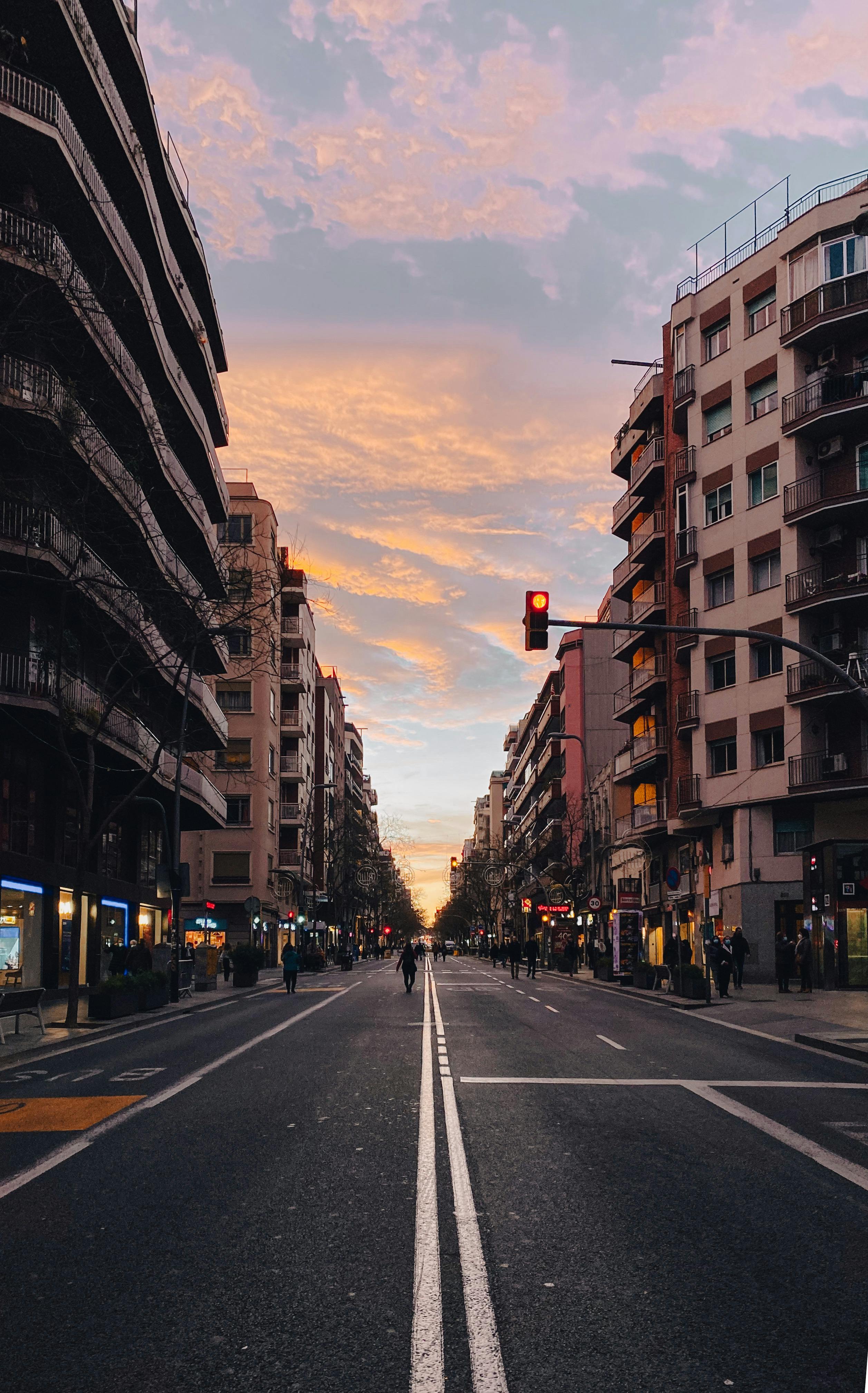 People Walking on Street Near White Concrete Building · Free Stock Photo