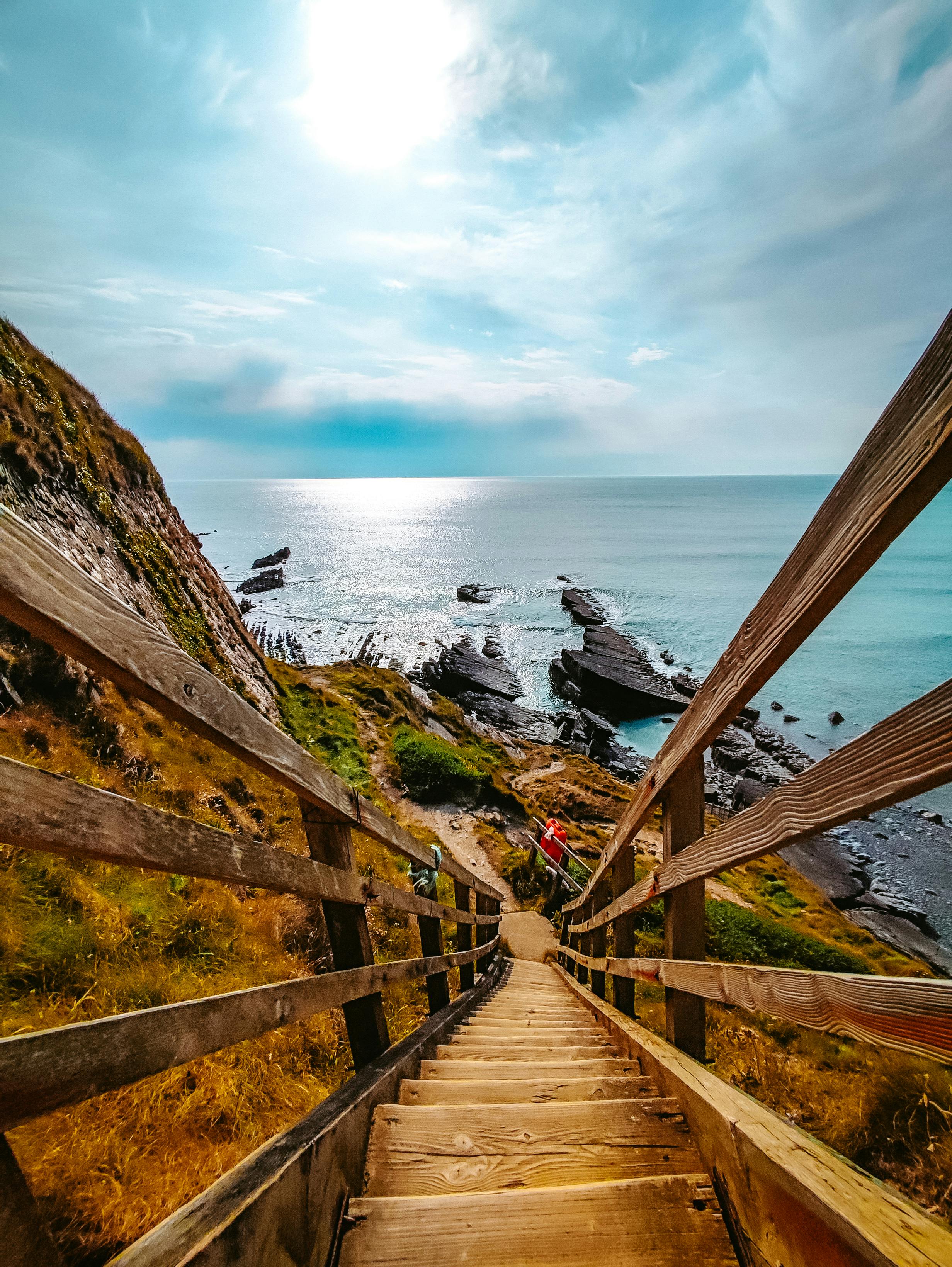 Stairs Railing Disappearing into Sea · Free Stock Photo
