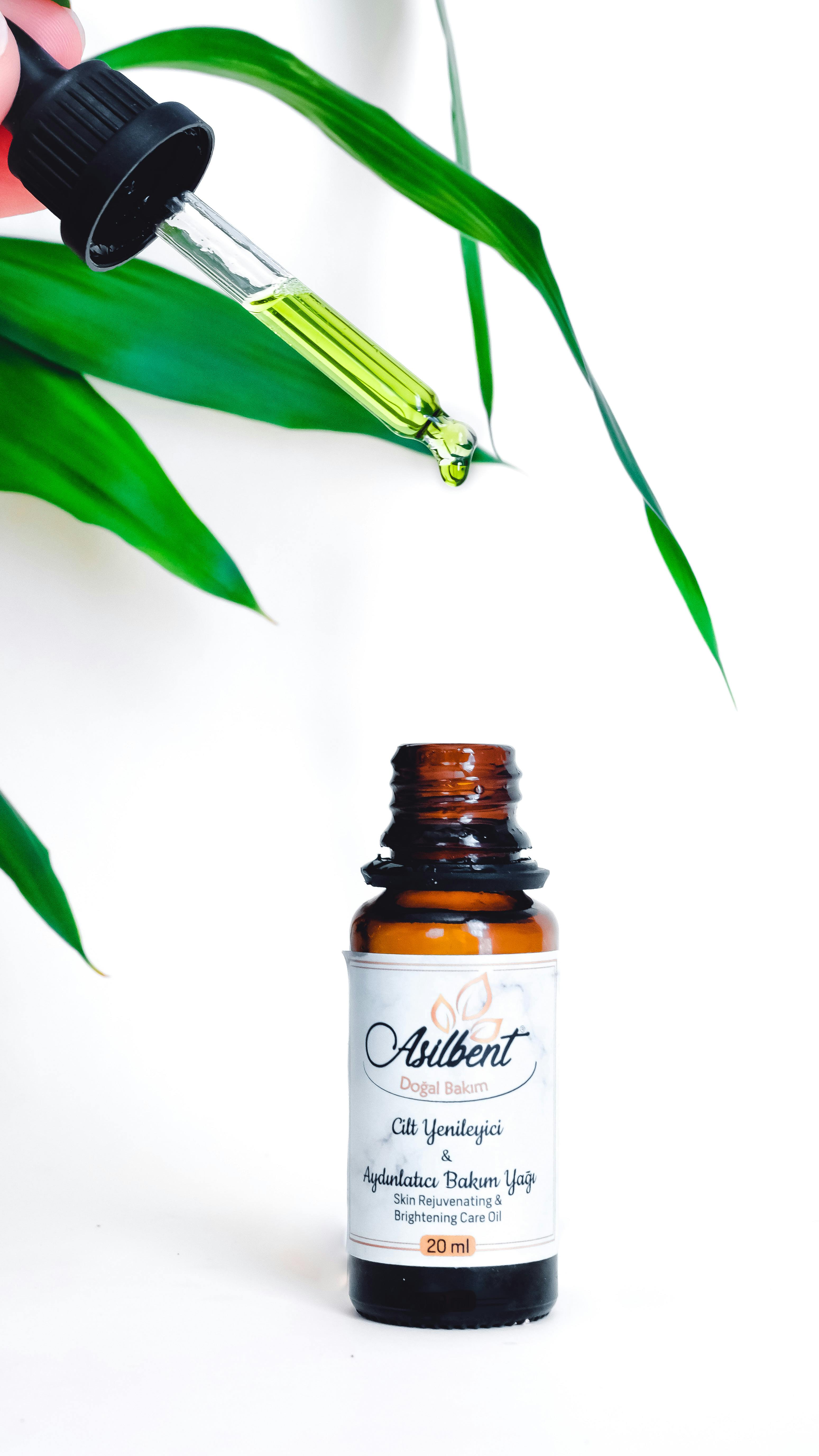 Open Flask and Leaves near · Free Stock Photo