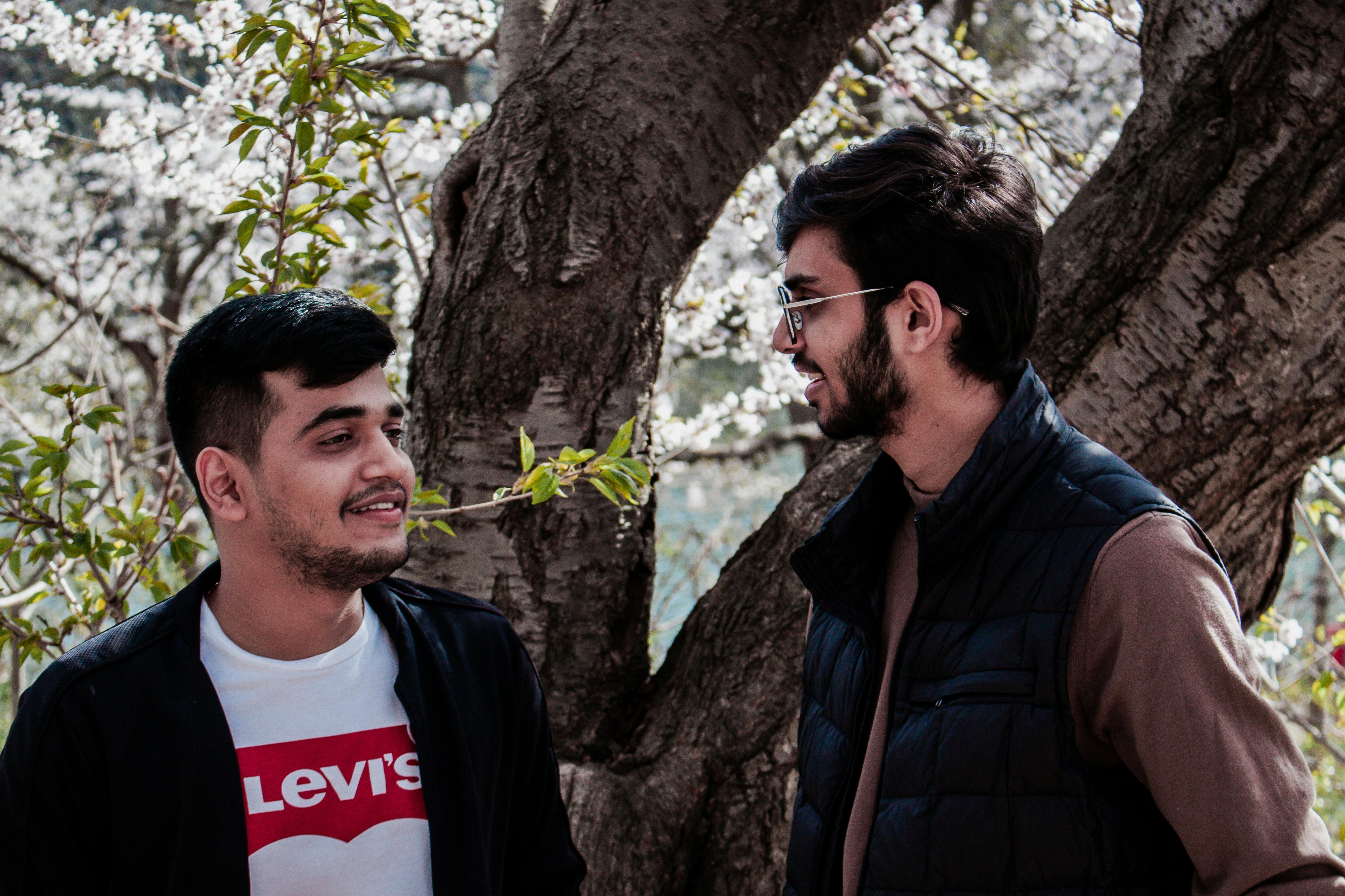 Two Men Talking Together · Free Stock Photo