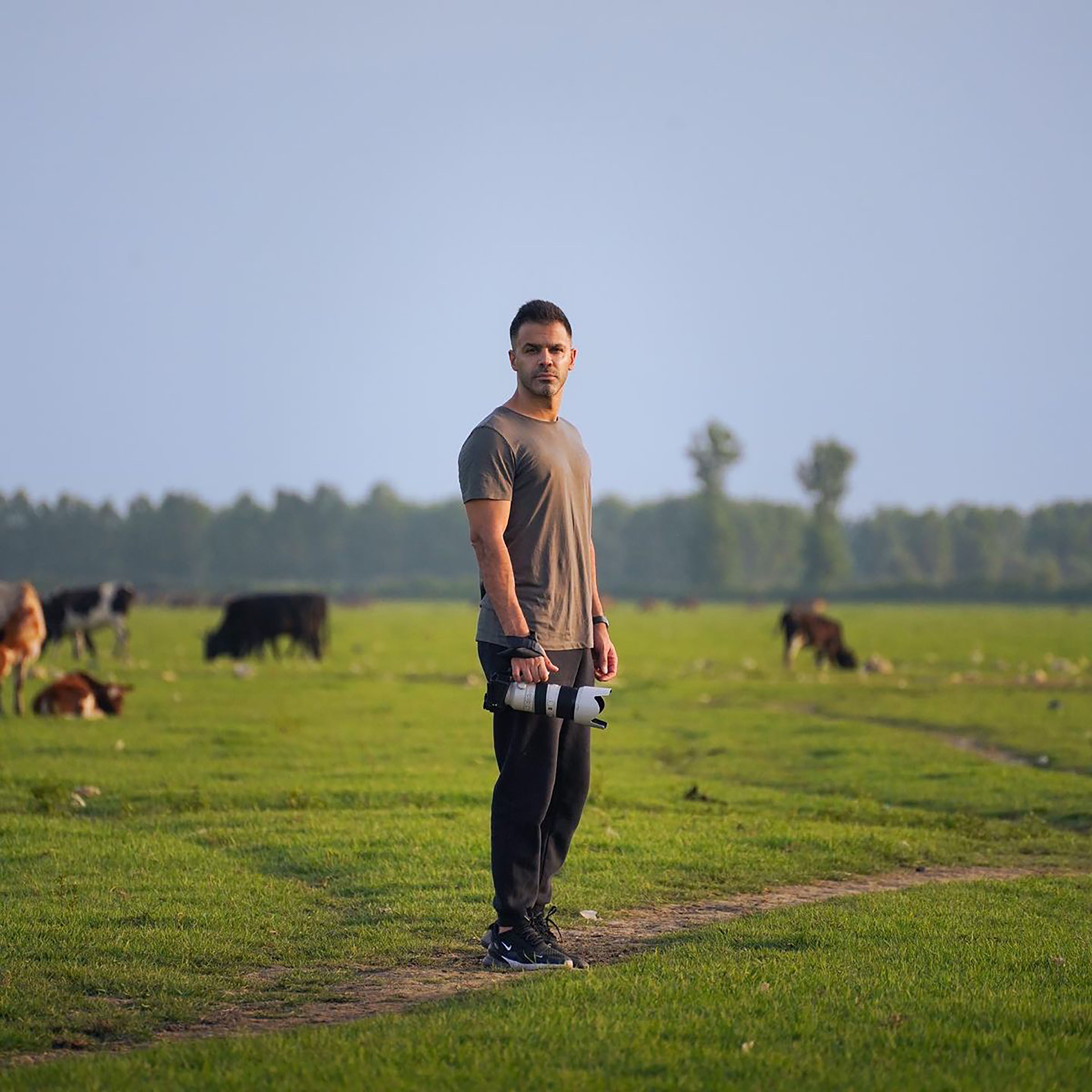 Man Standing on Green Grass Field · Free Stock Photo