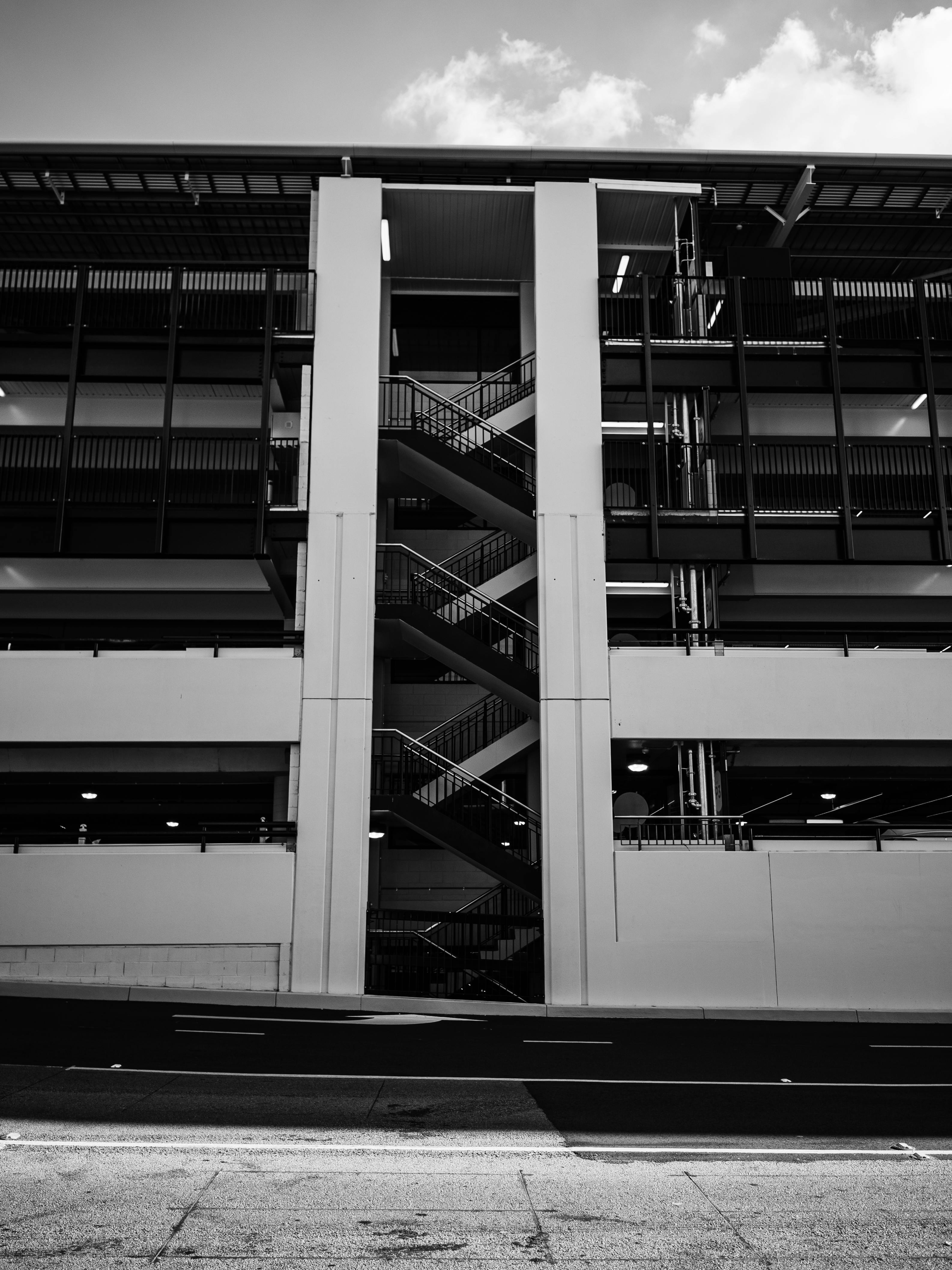 Grayscale Photo of a Concrete Building · Free Stock Photo