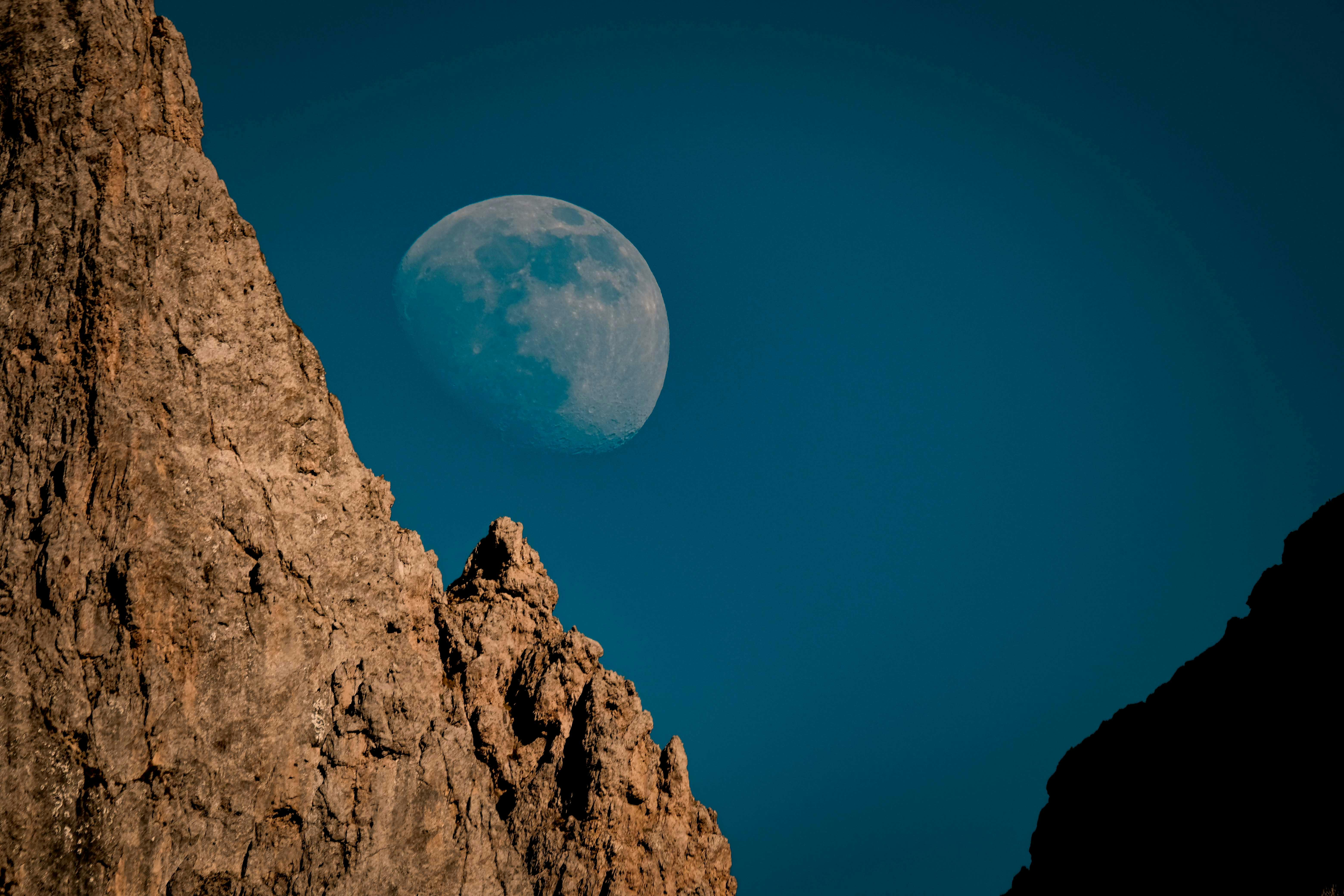 Moon behind Rock · Free Stock Photo