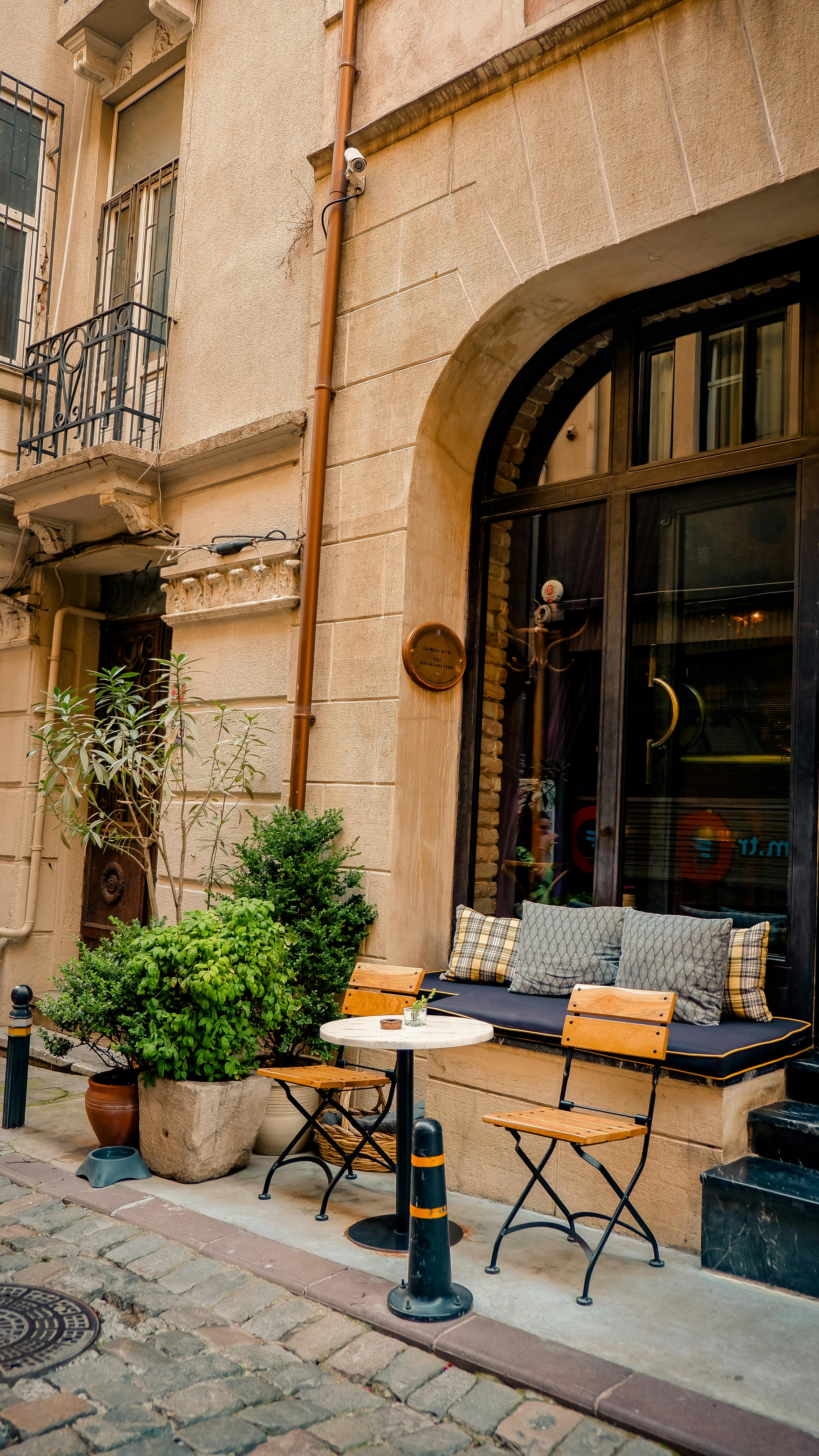 Brown and Orange 3-piece Patio Set Outside A Coffee Shop · Free Stock Photo