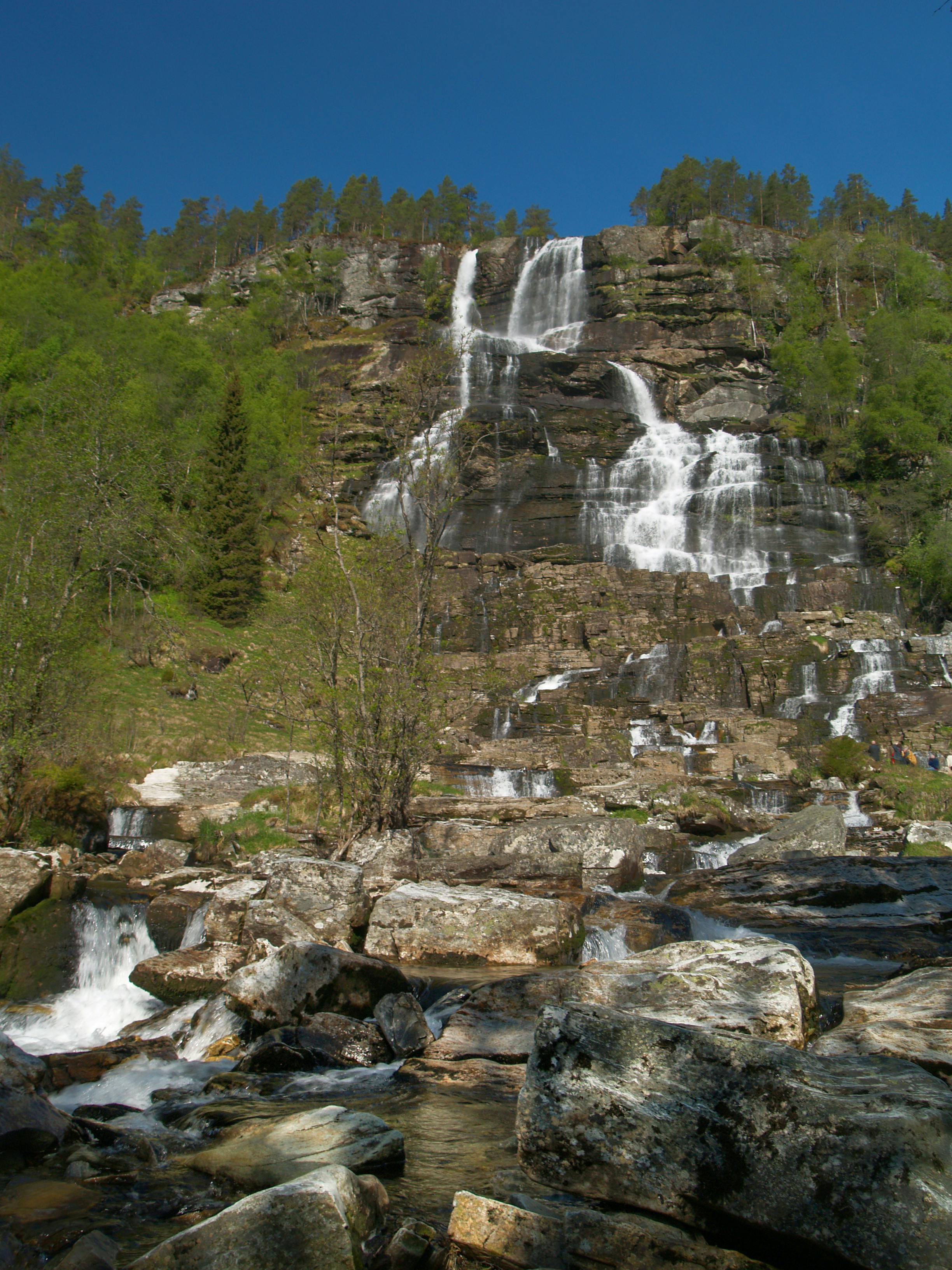 River Cascading down Rock Steep Slope on Tvindefossen Waterfall in ...