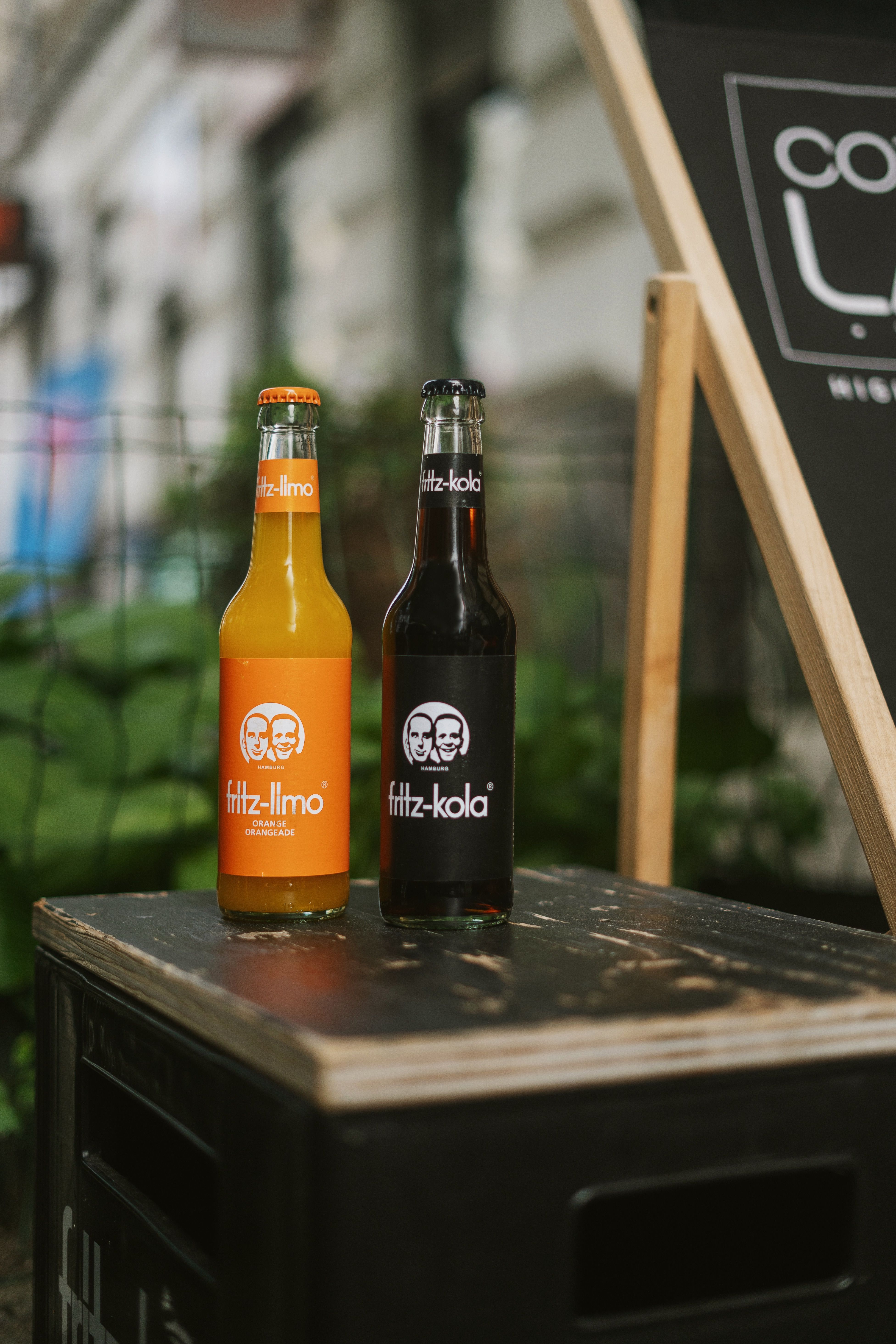 A Bottle of Soda on an Orange Background · Free Stock Photo