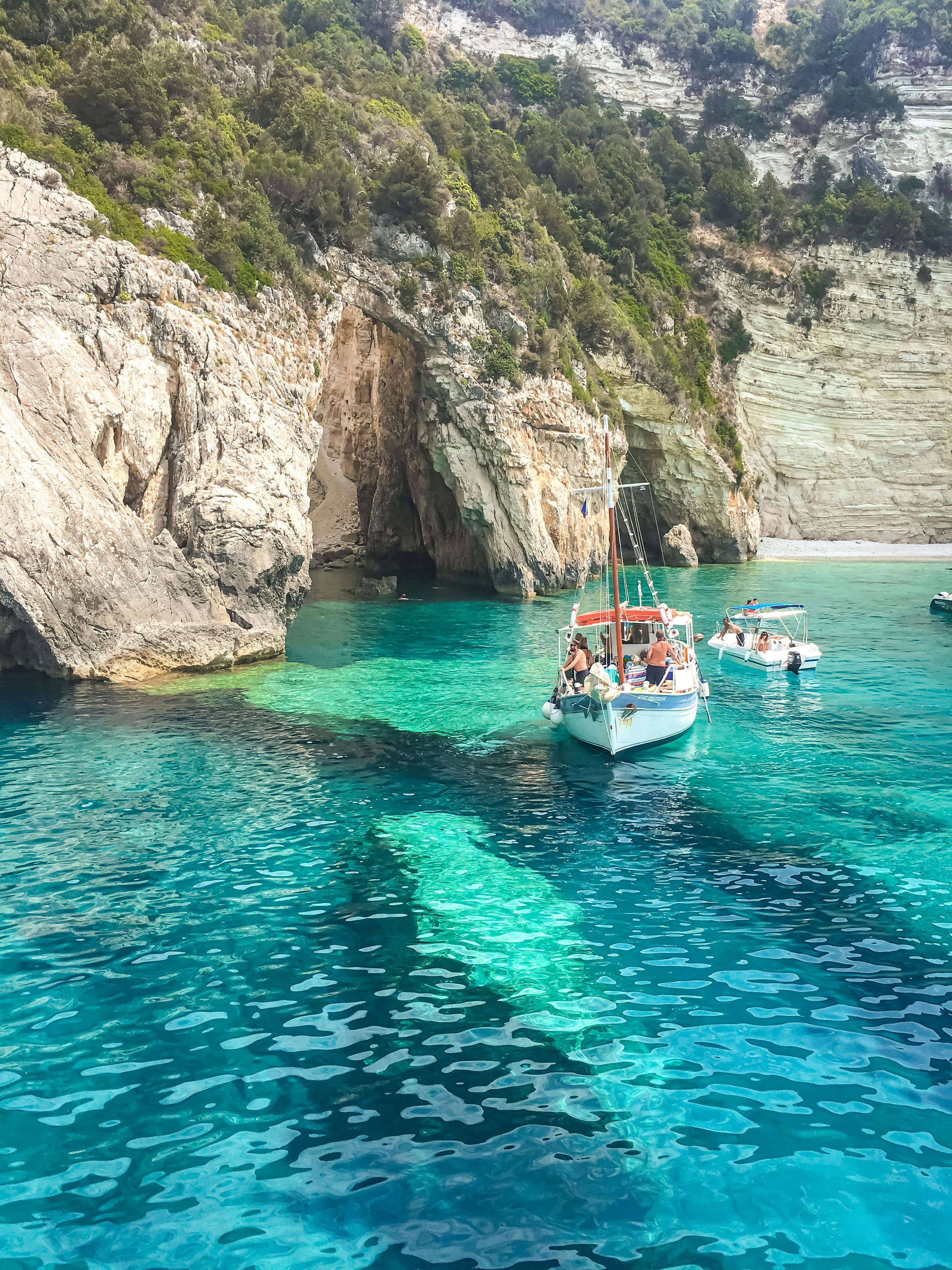 People Riding on Boat on Body of Water · Free Stock Photo