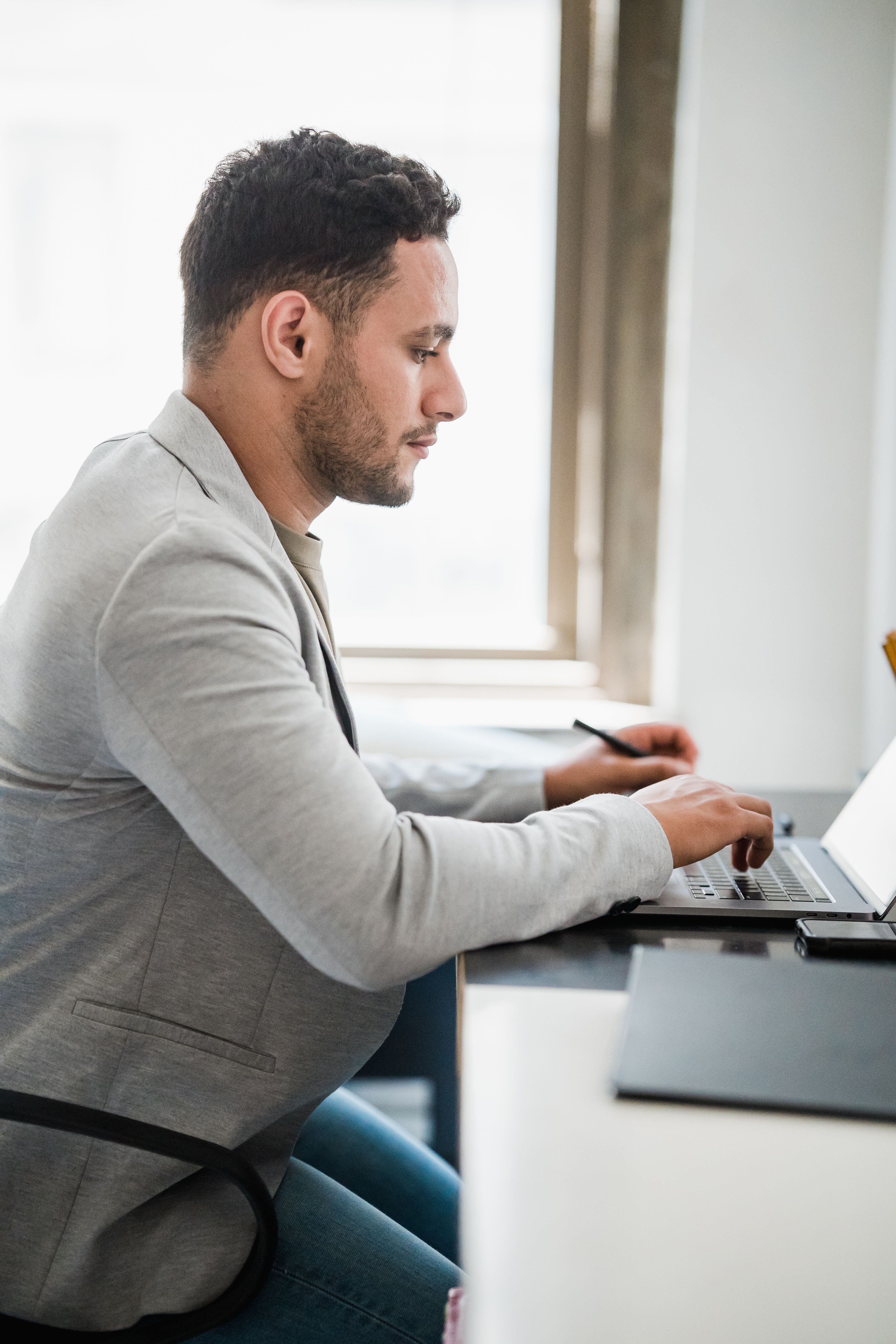 Man Working with Laptop in Office · Free Stock Photo