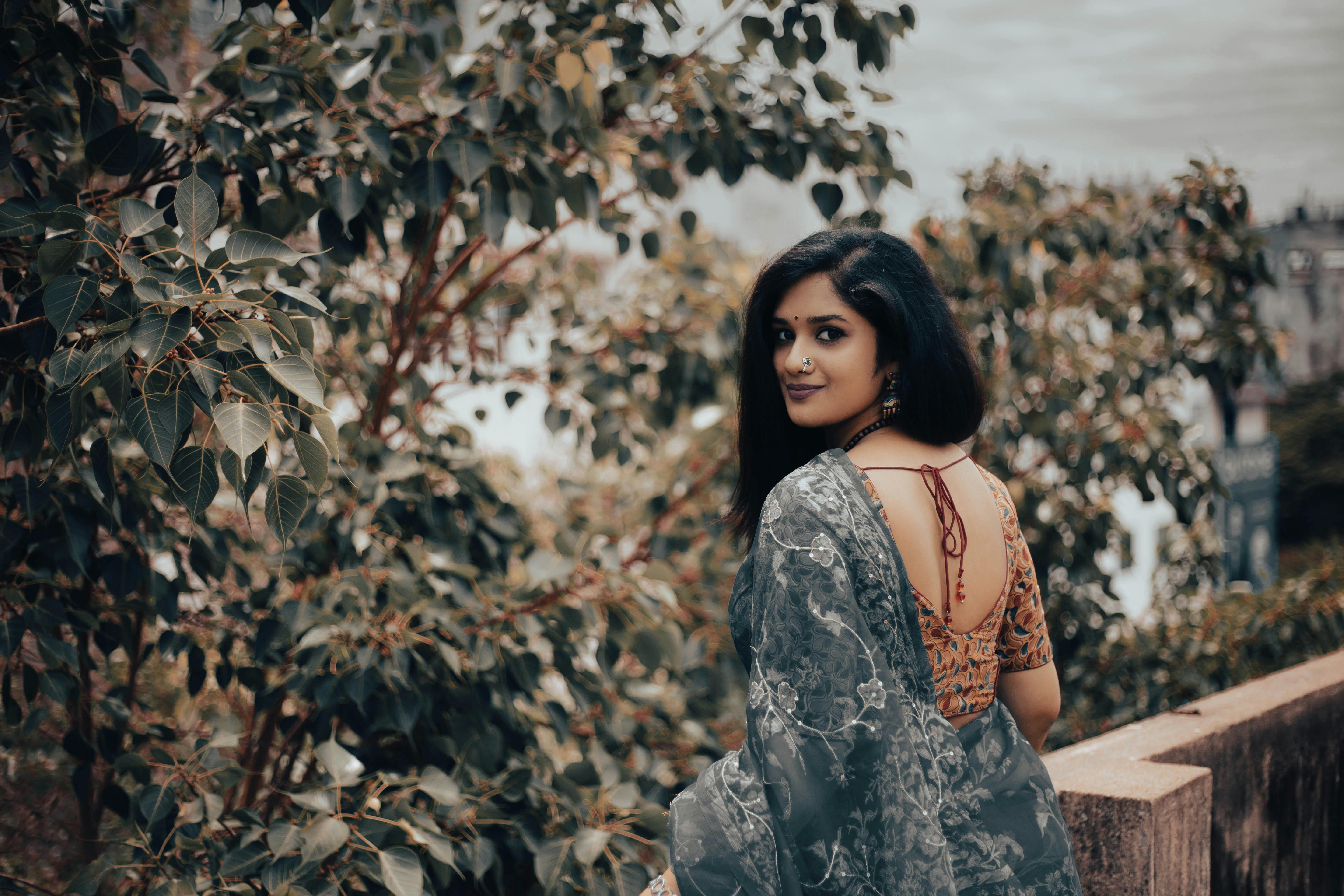Beautiful Woman Wearing Traditional Dress in Garden · Free Stock Photo