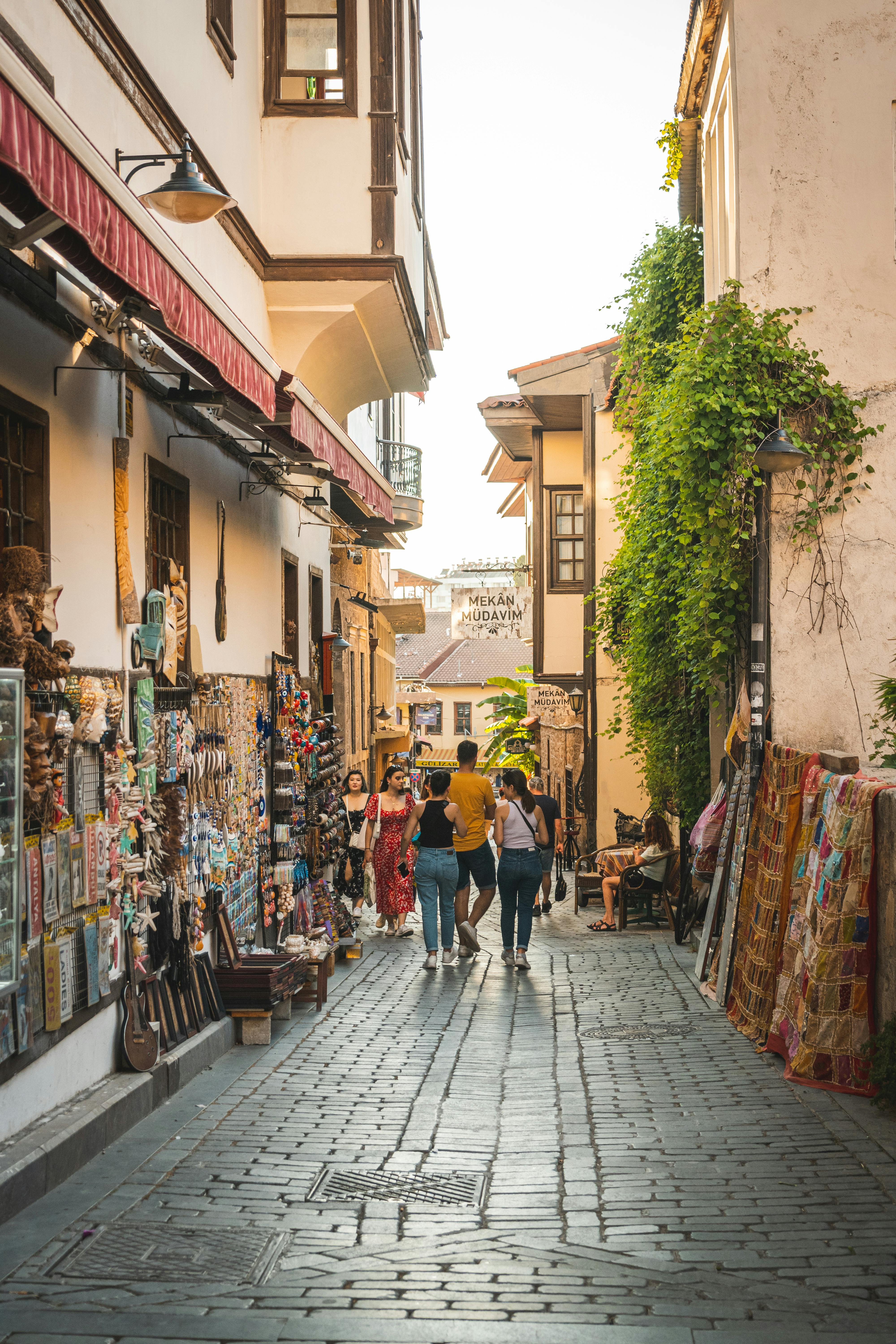 People Walking on a Street with Shops · Free Stock Photo