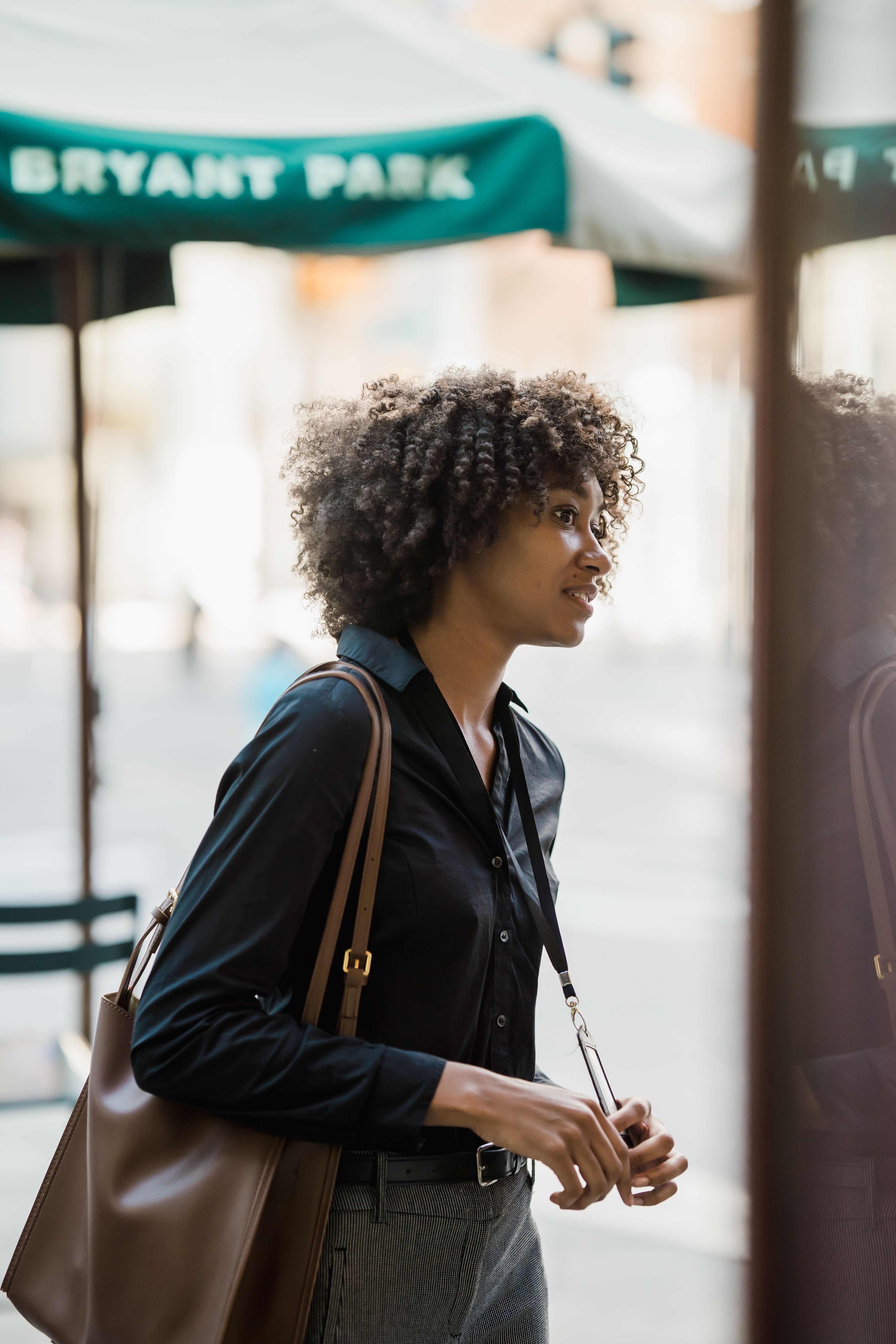 Woman with ID Card on City Street · Free Stock Photo