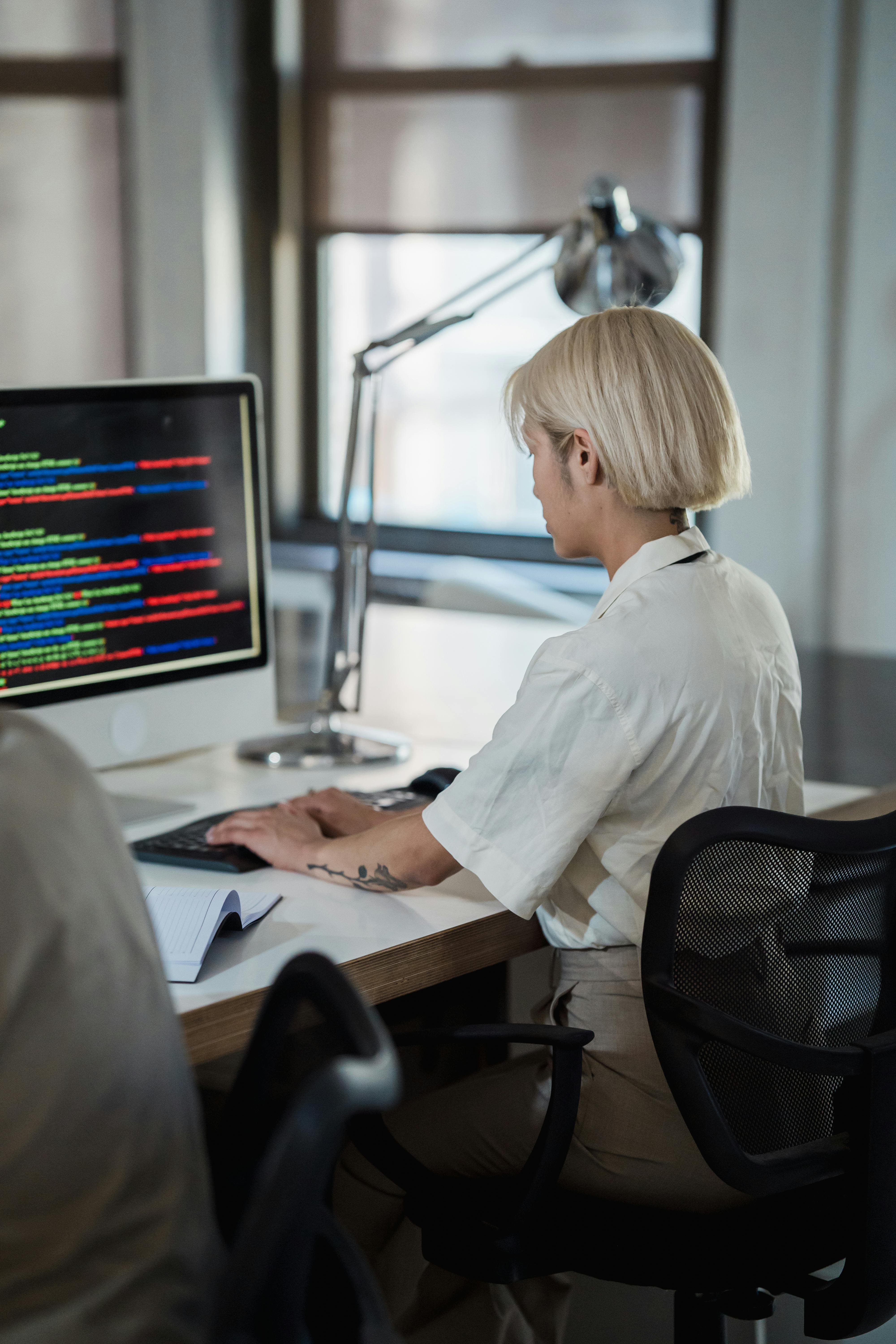 Woman Working on Computer in Office · Free Stock Photo