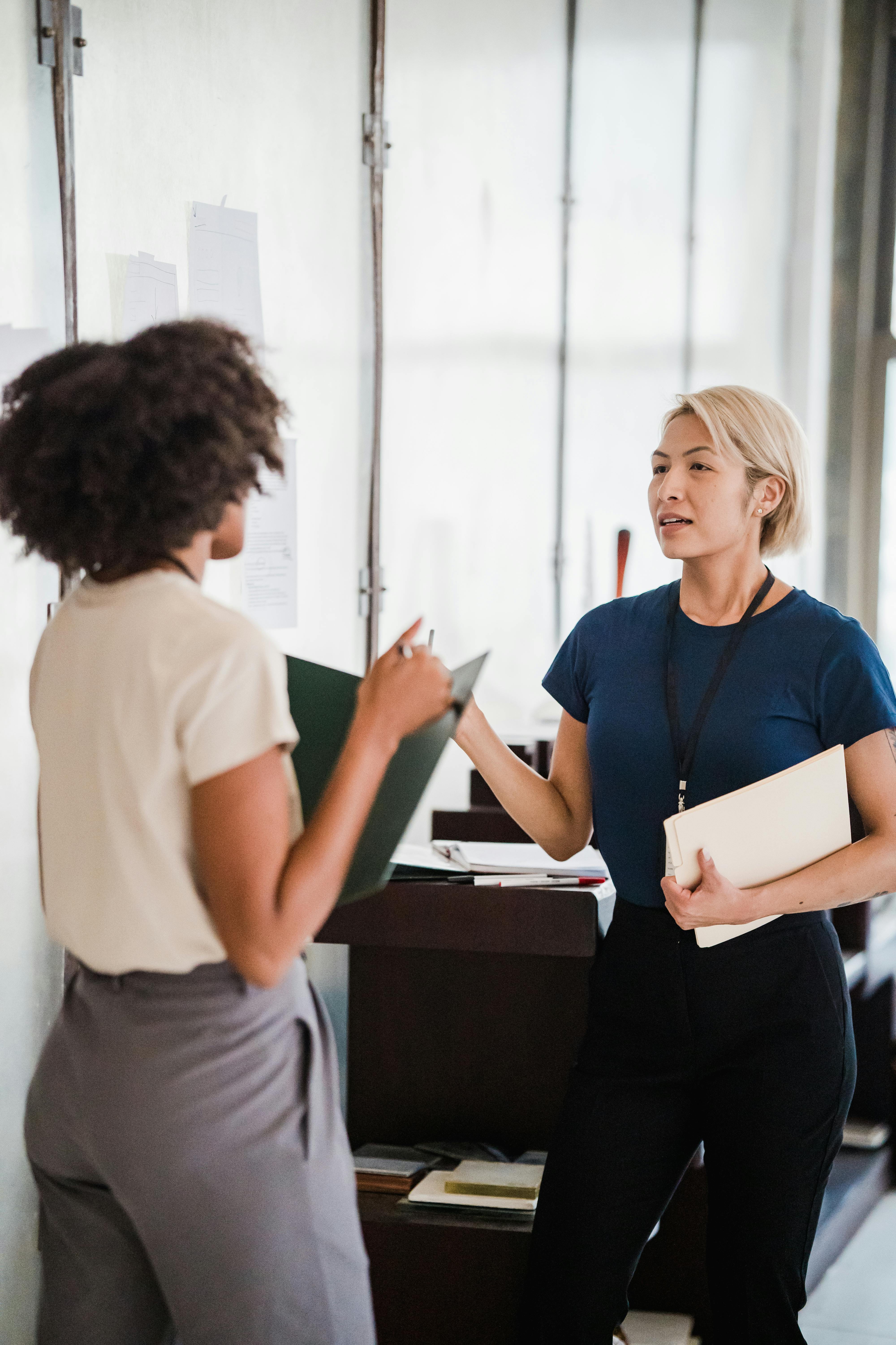 Women Talking in Office · Free Stock Photo