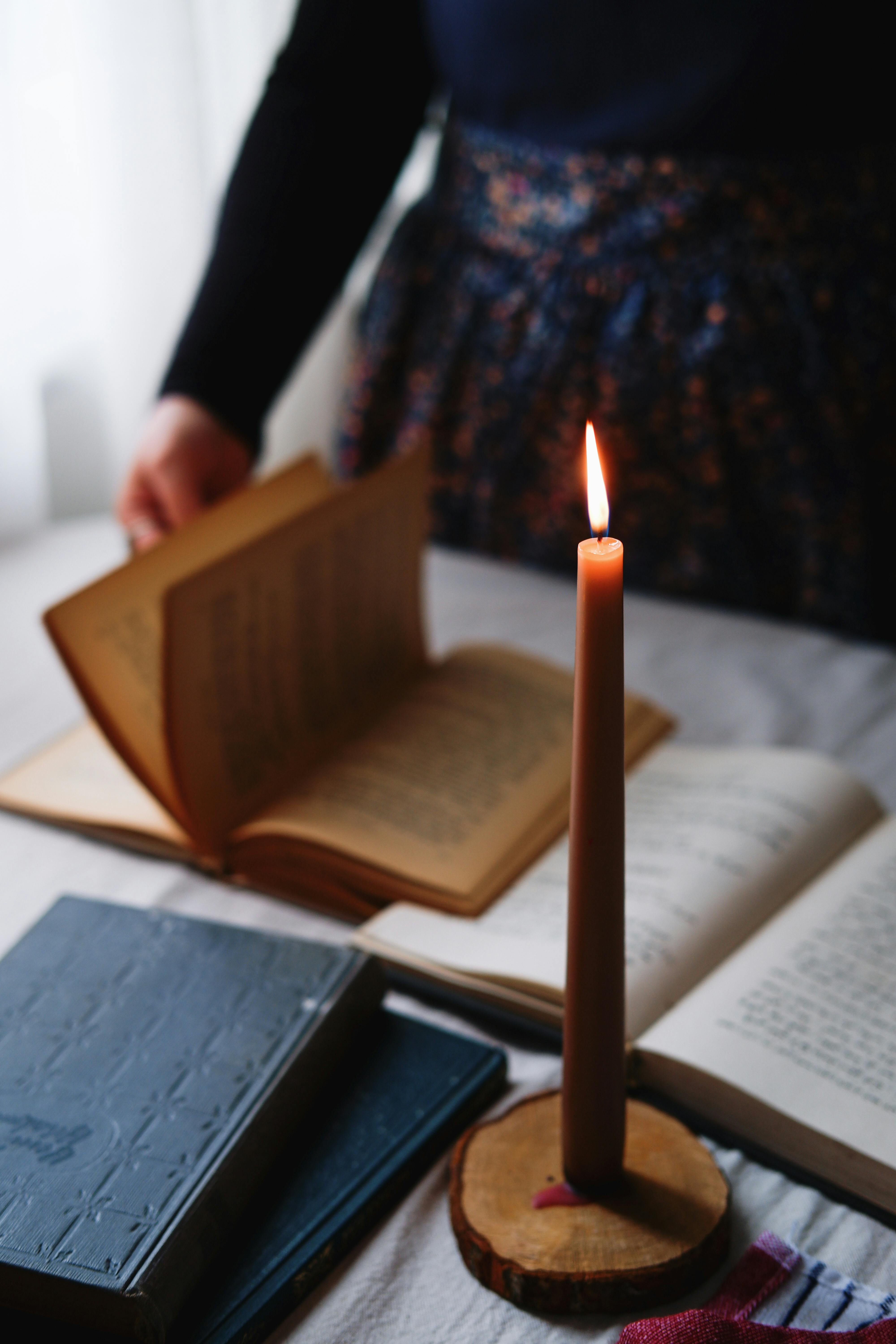 Close Up of Candle and Books on Table · Free Stock Photo