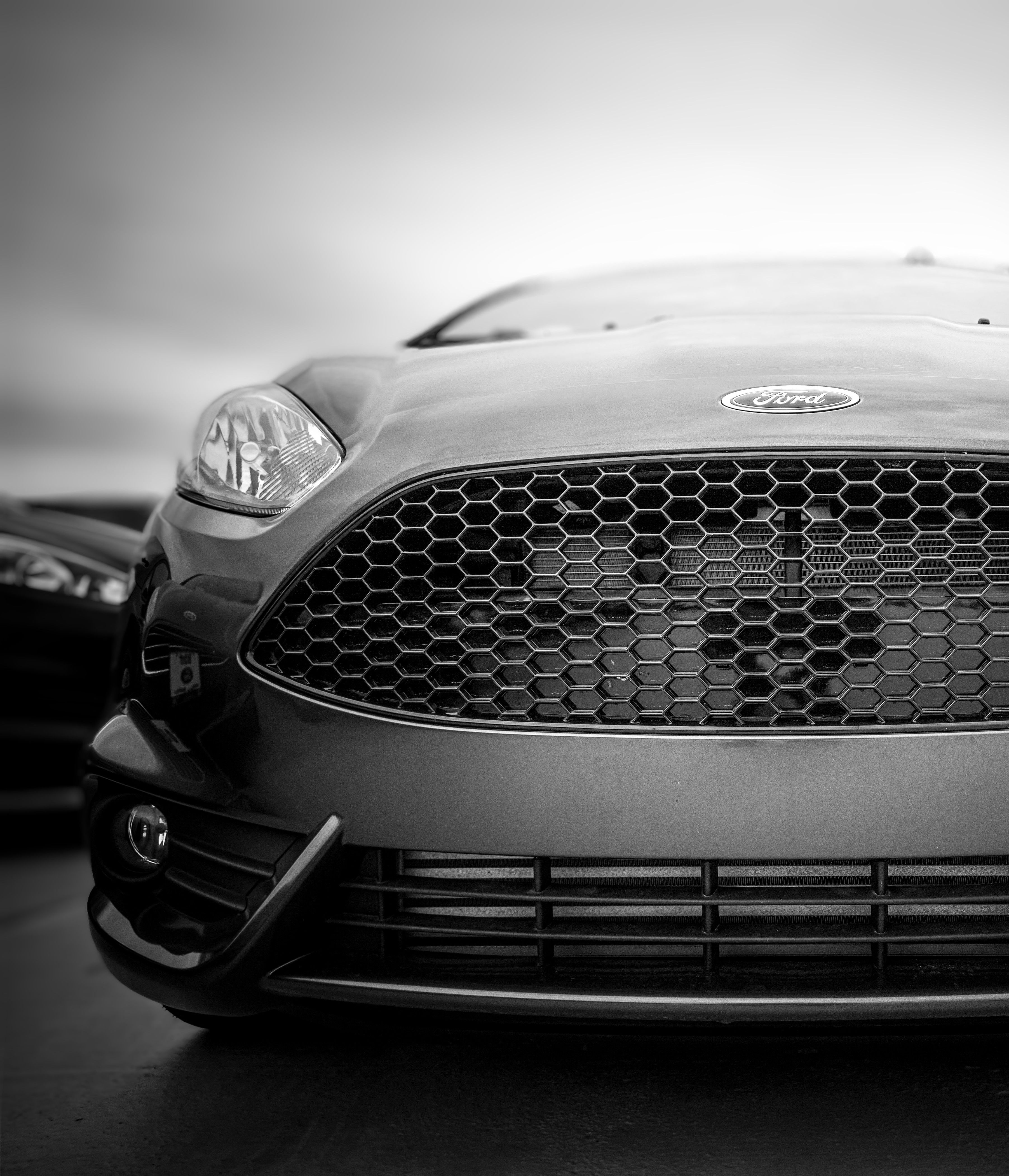 Grayscale Photo of a Sports Car · Free Stock Photo
