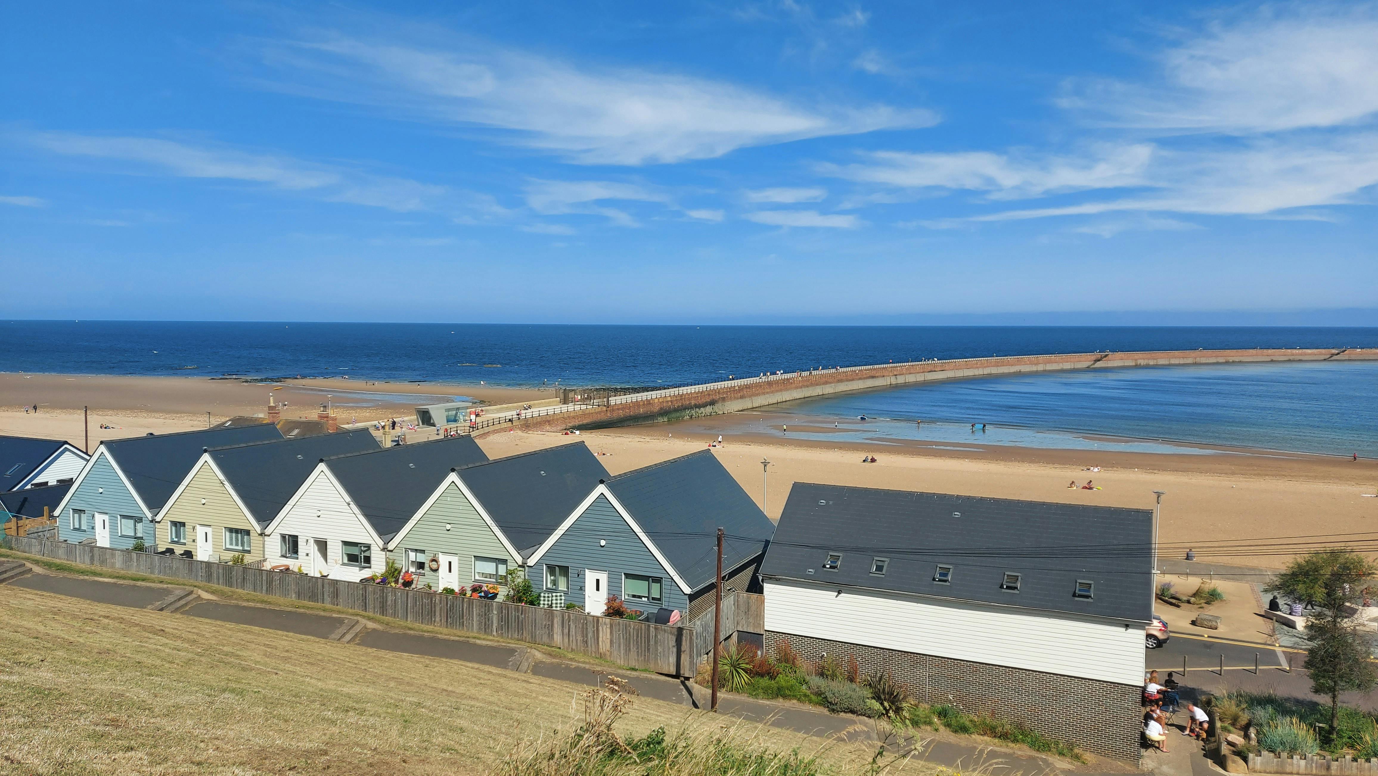 Buildings on Pier on Beach · Free Stock Photo