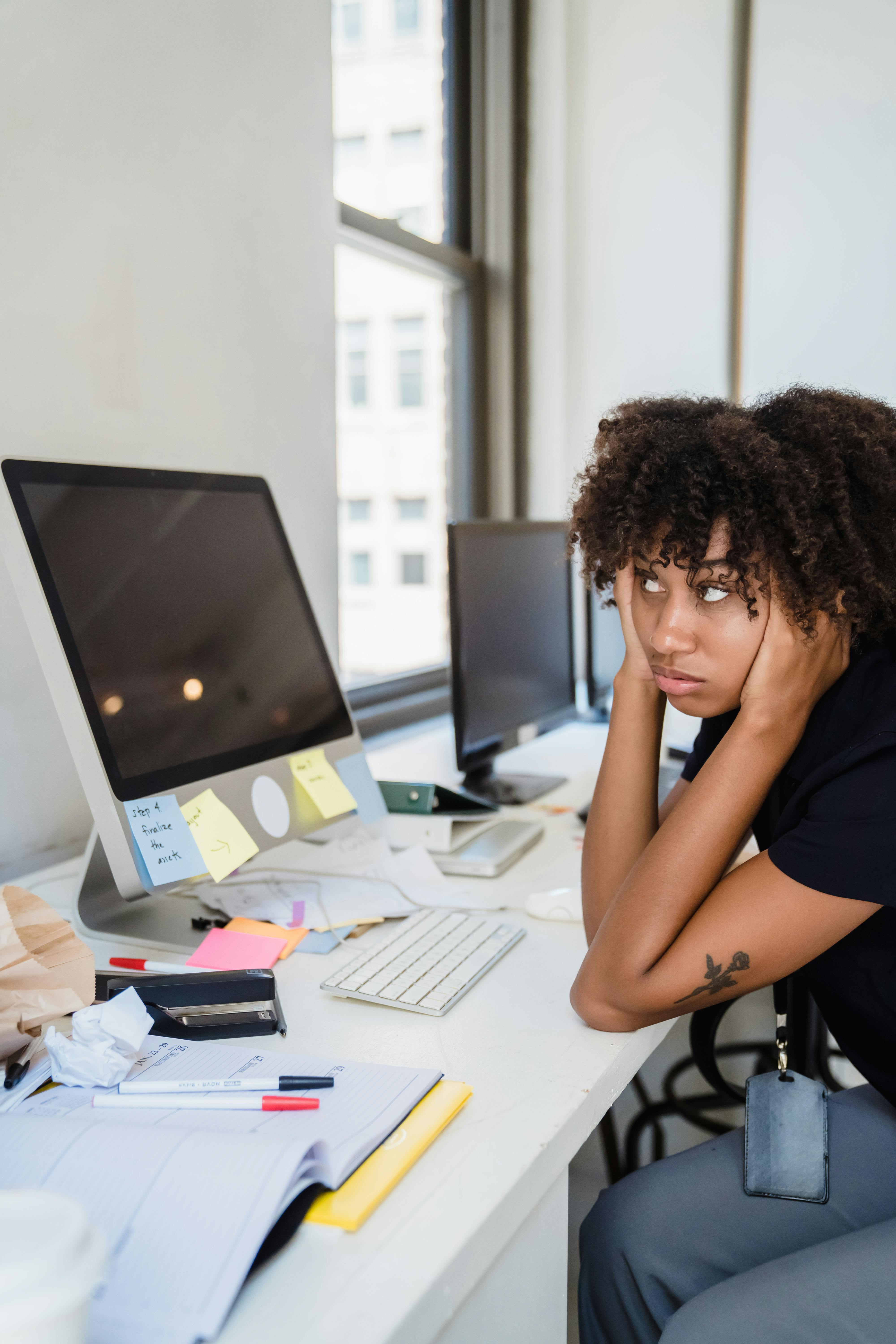Woman Sorting Documents at Work · Free Stock Photo