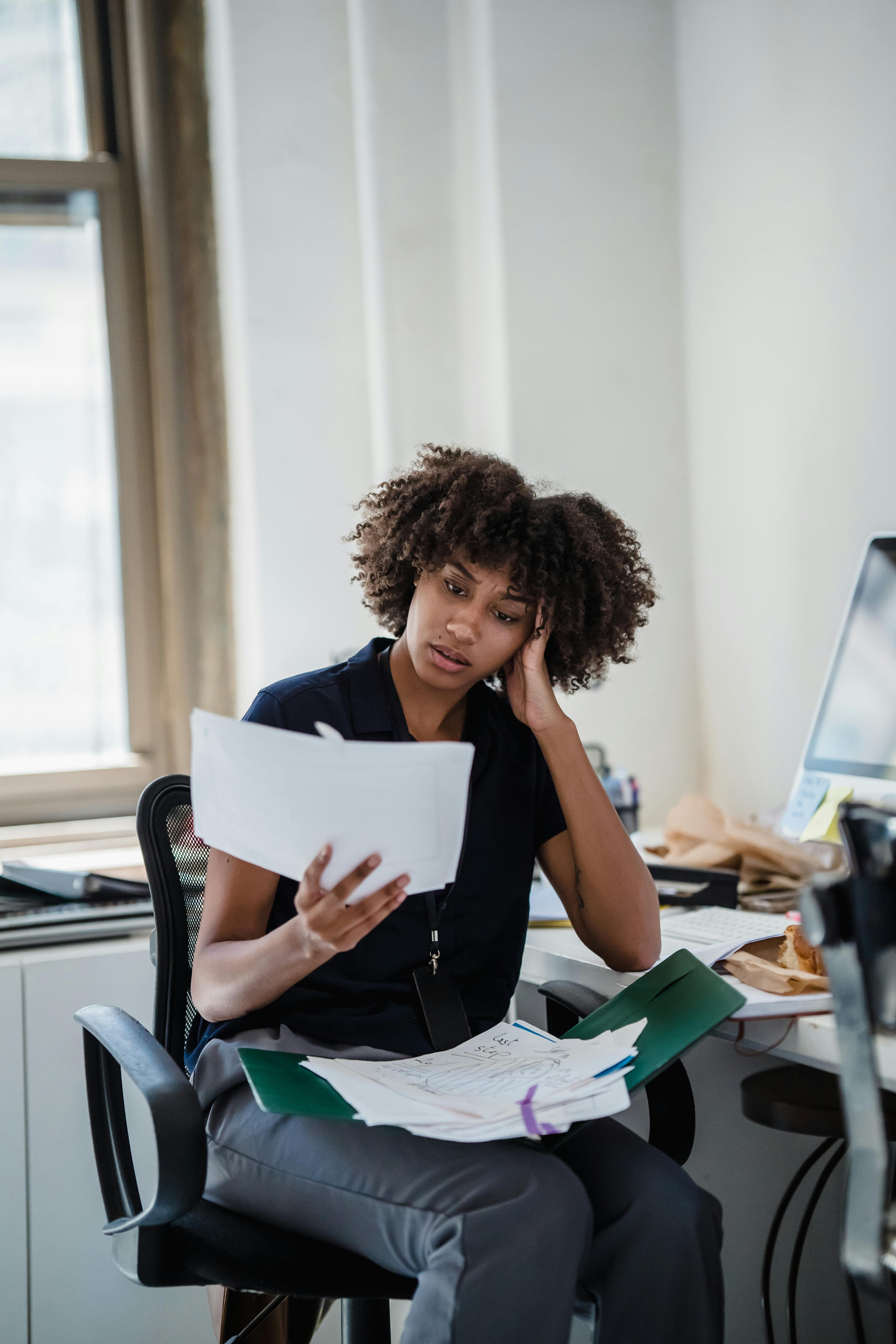 Woman Working With Documents in Office · Free Stock Photo