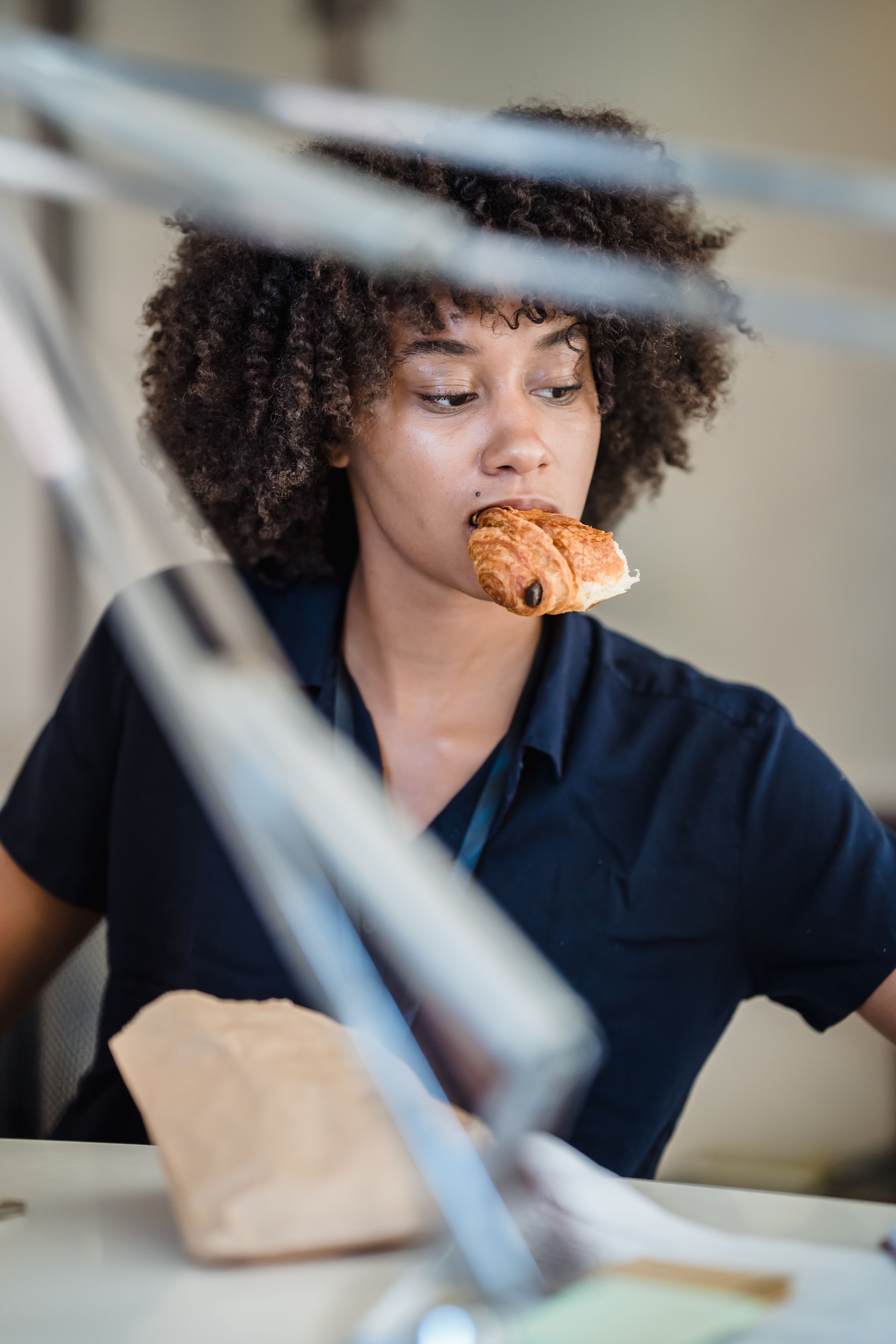 Woman Working and Eating at the Same Time · Free Stock Photo