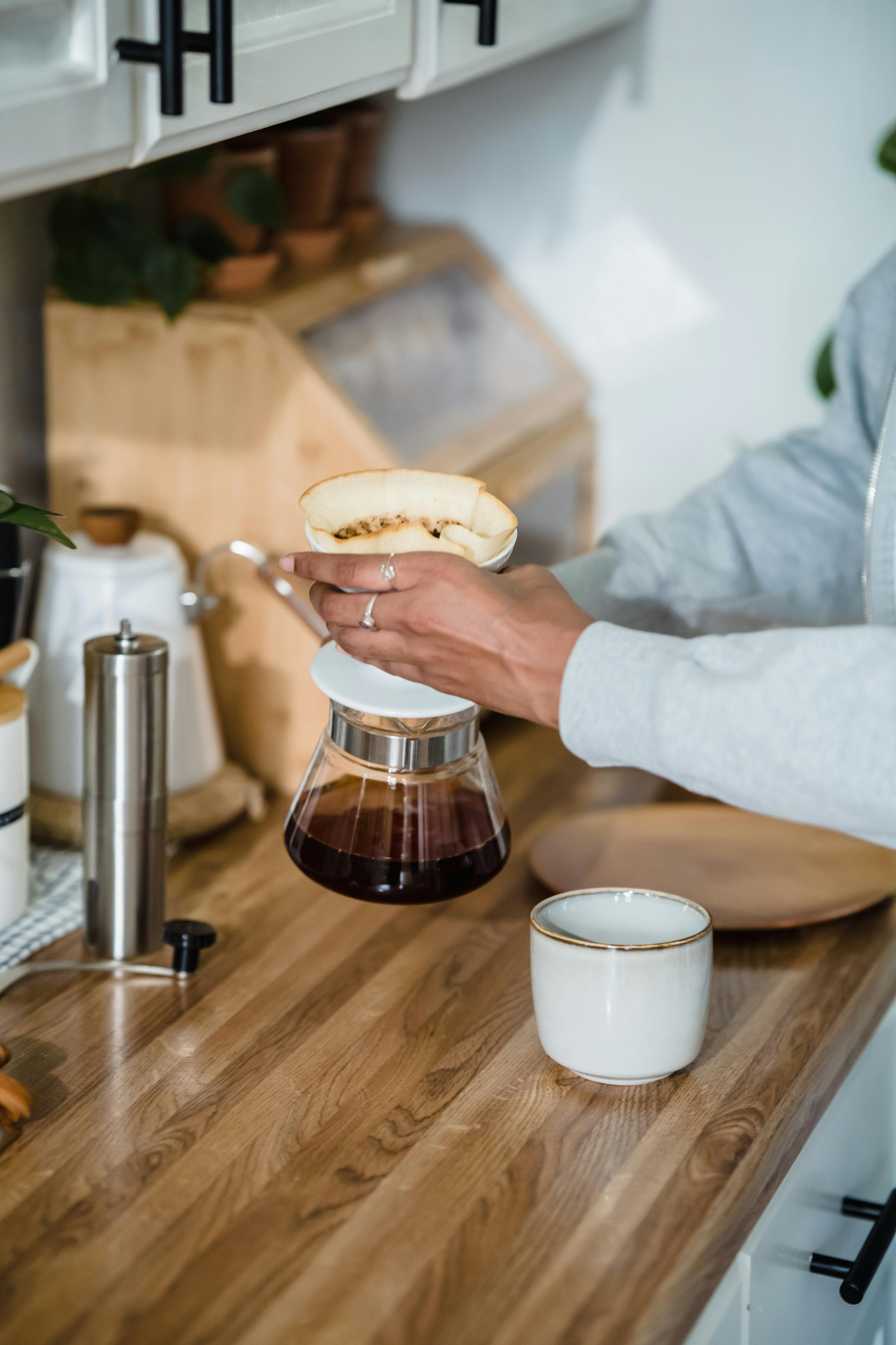 Close up of a Person Making Coffee · Free Stock Photo