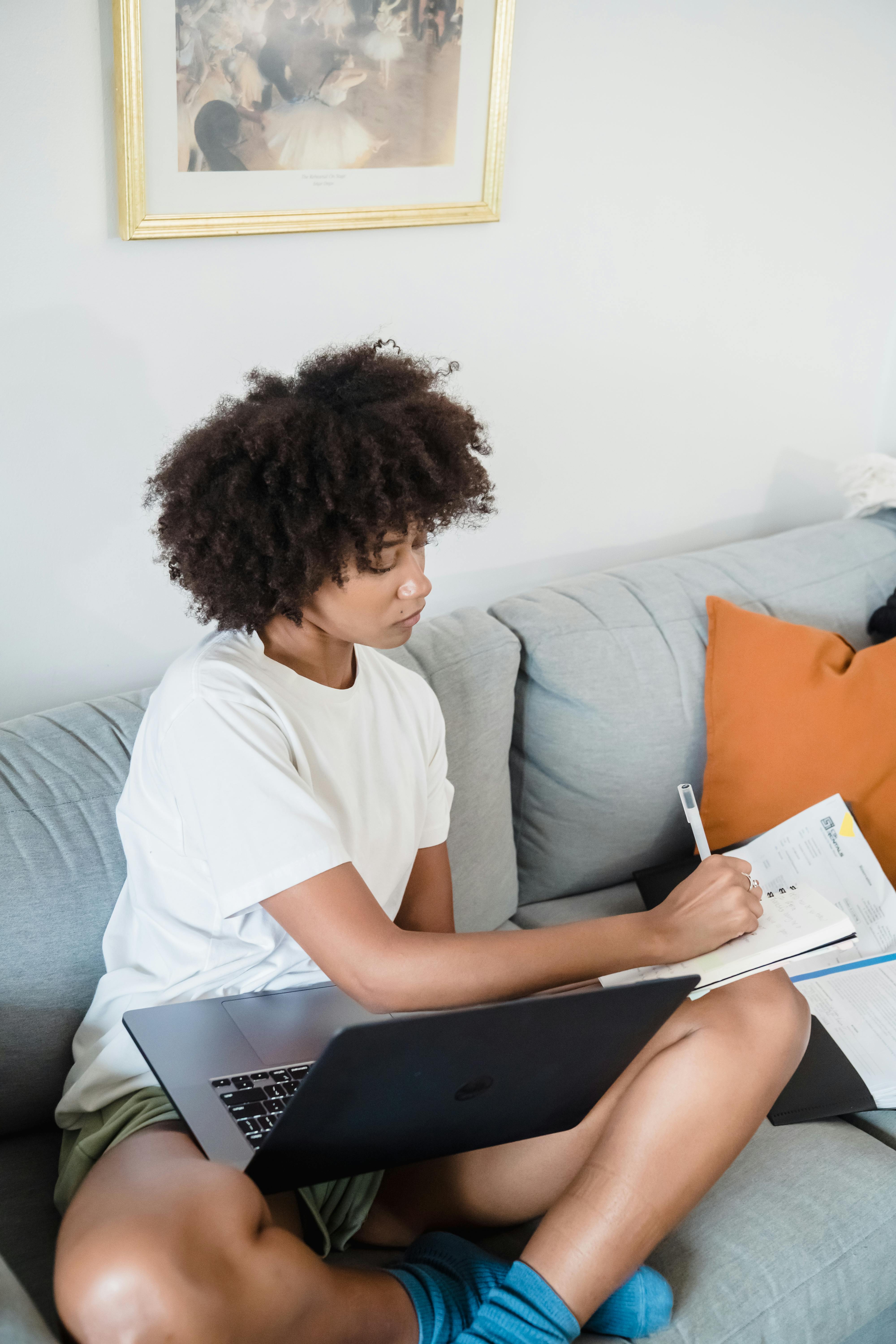 Woman Working on Laptop Taking Notes · Free Stock Photo