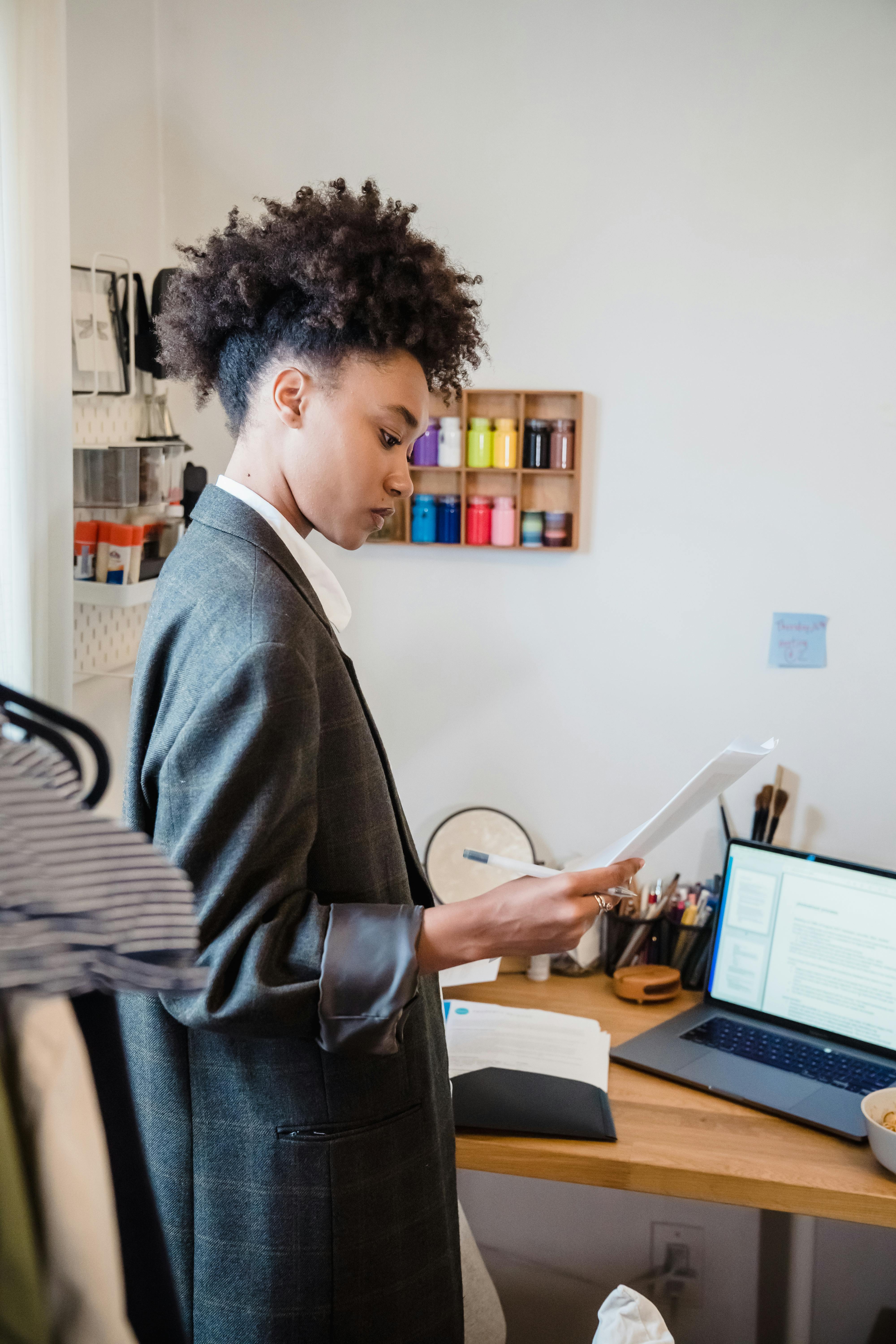 Woman with Documents and Laptop · Free Stock Photo