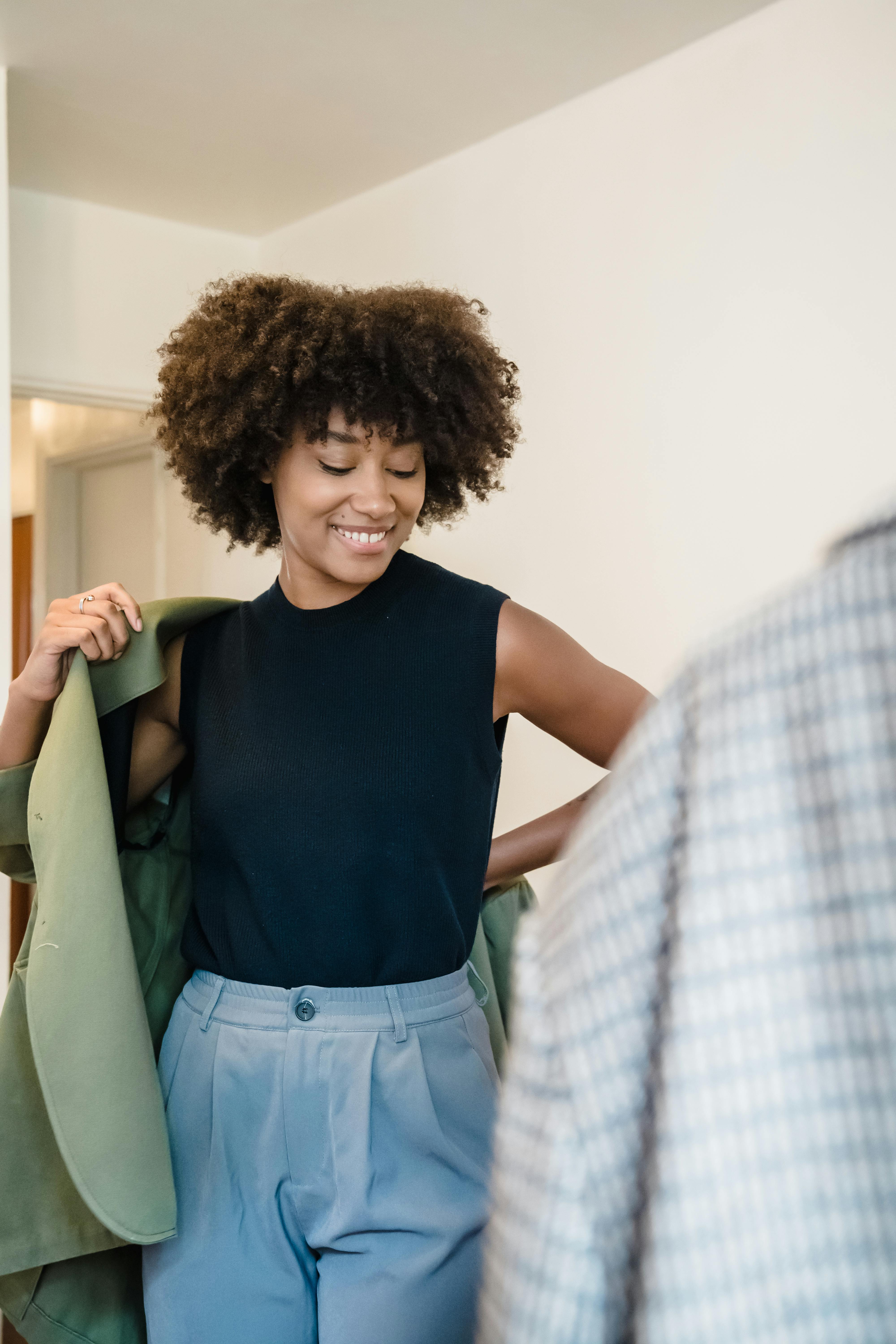 Smiling Woman Wearing Clothes · Free Stock Photo