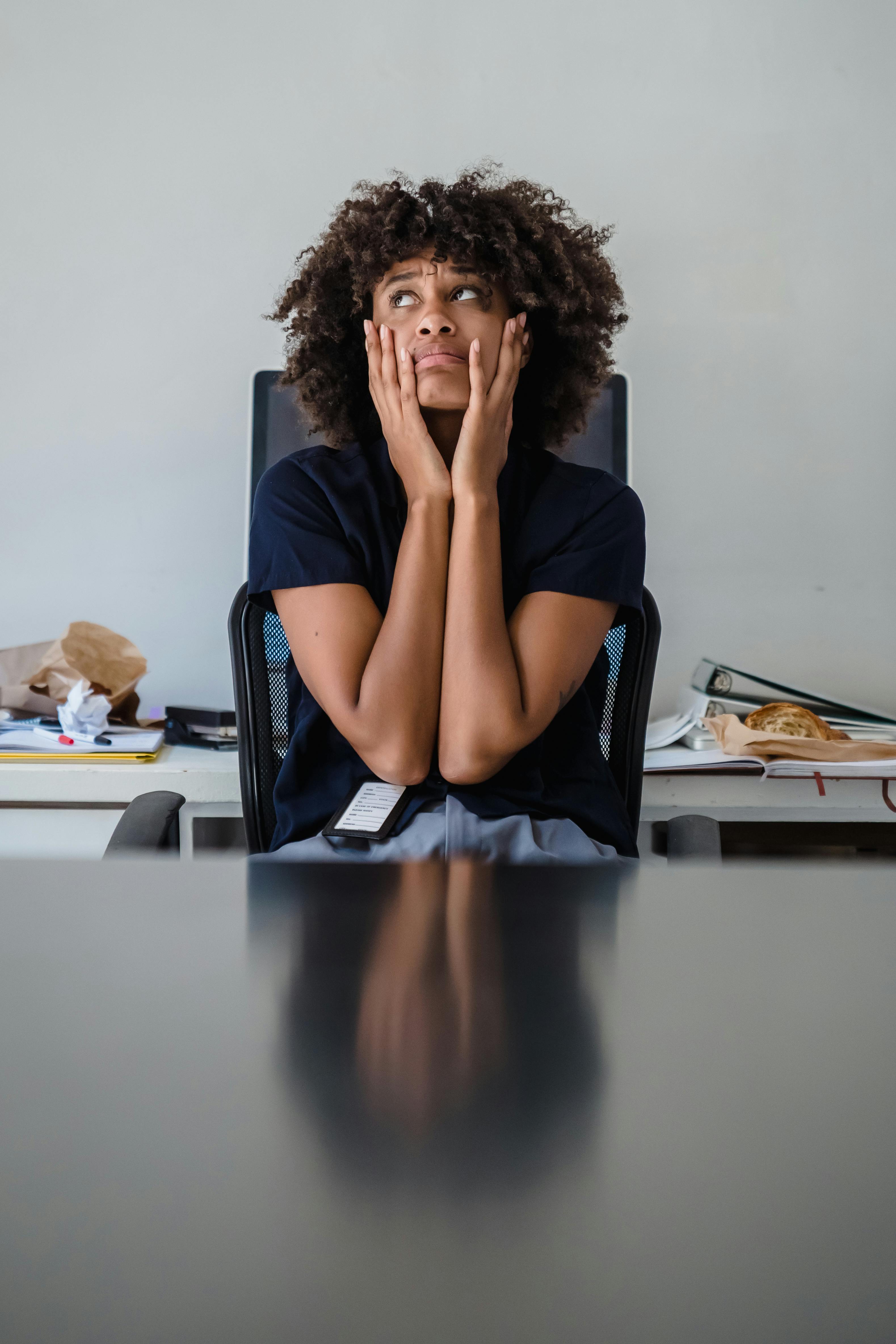 Woman Putting Her Head Down on the Desk · Free Stock Photo