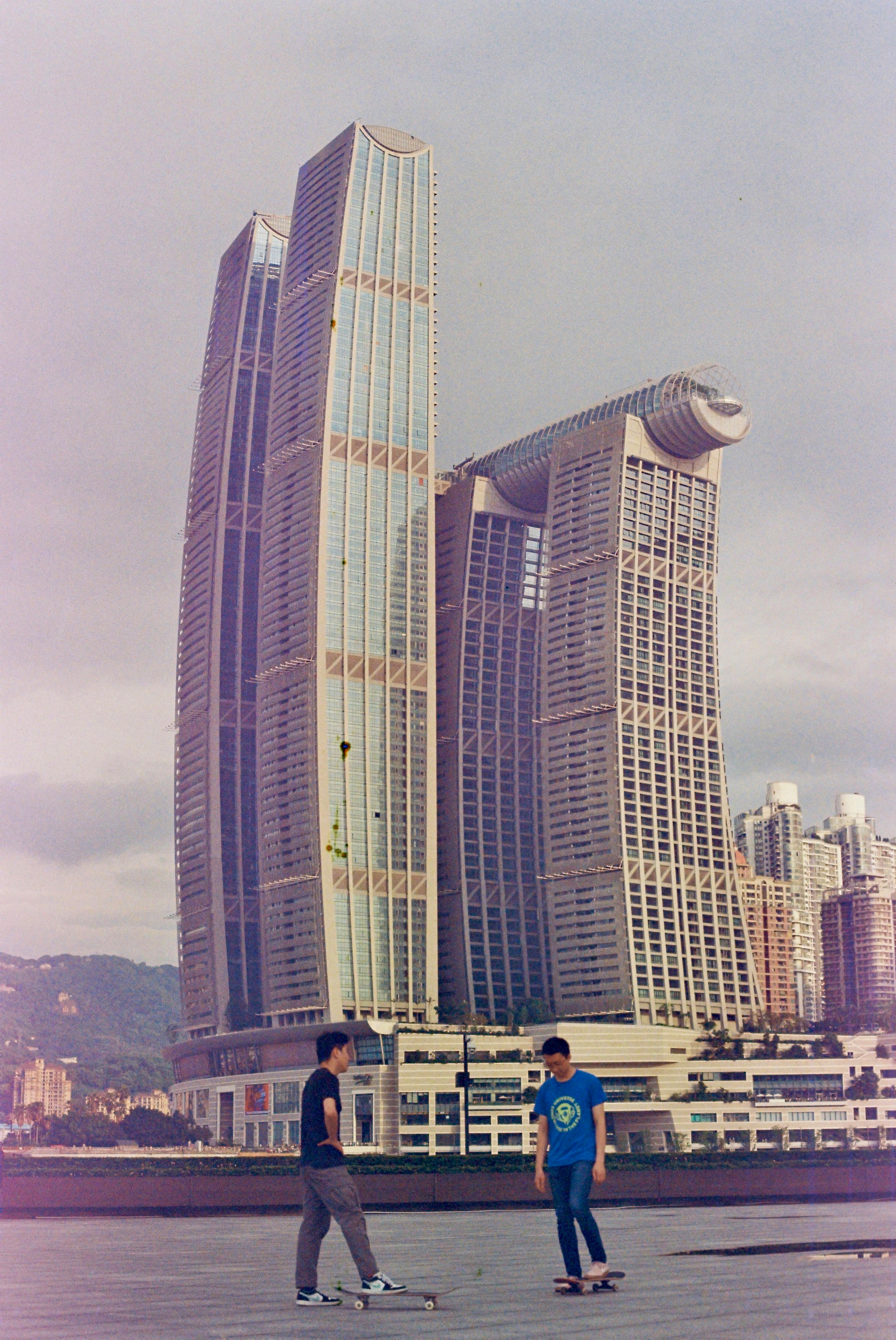Two People Near High Rise Buildings · Free Stock Photo