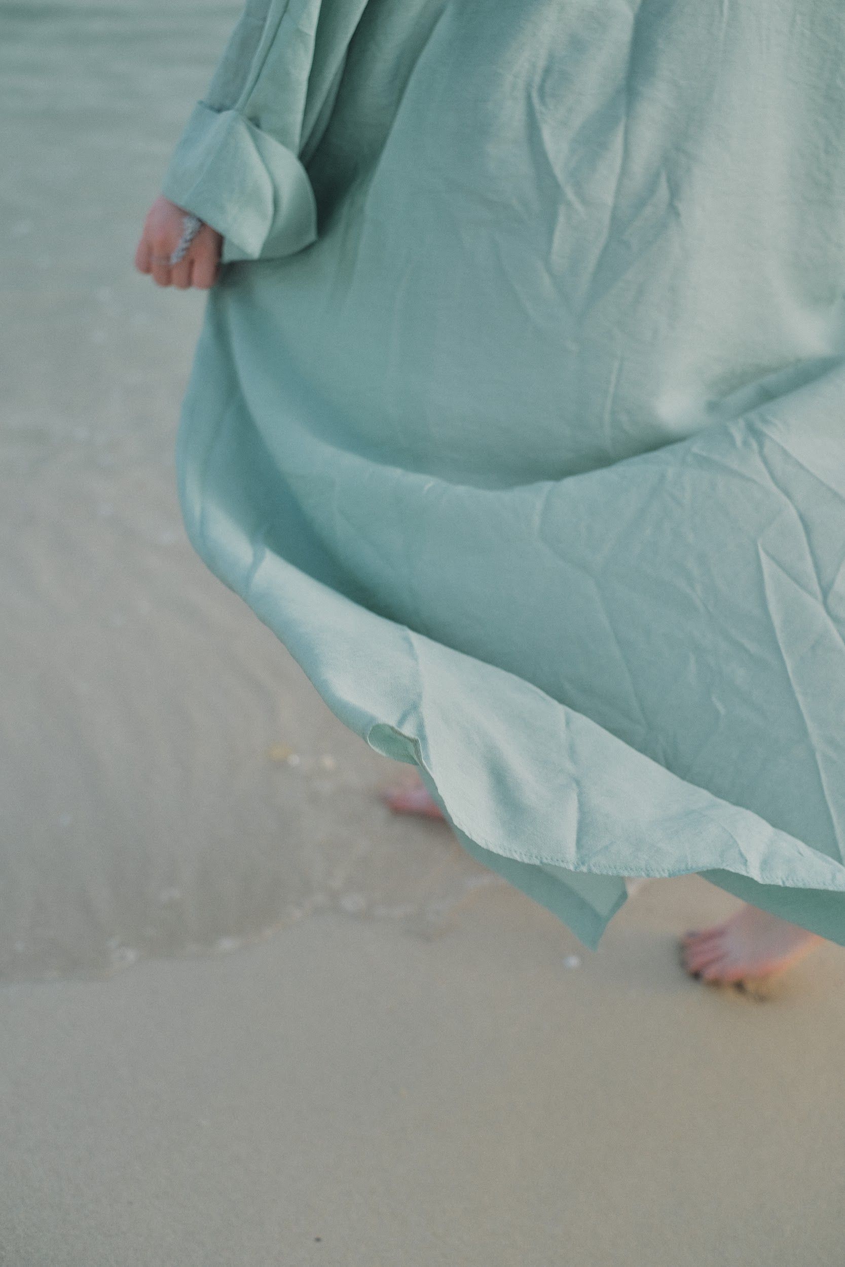 Person in Green Dress Standing on Beach · Free Stock Photo
