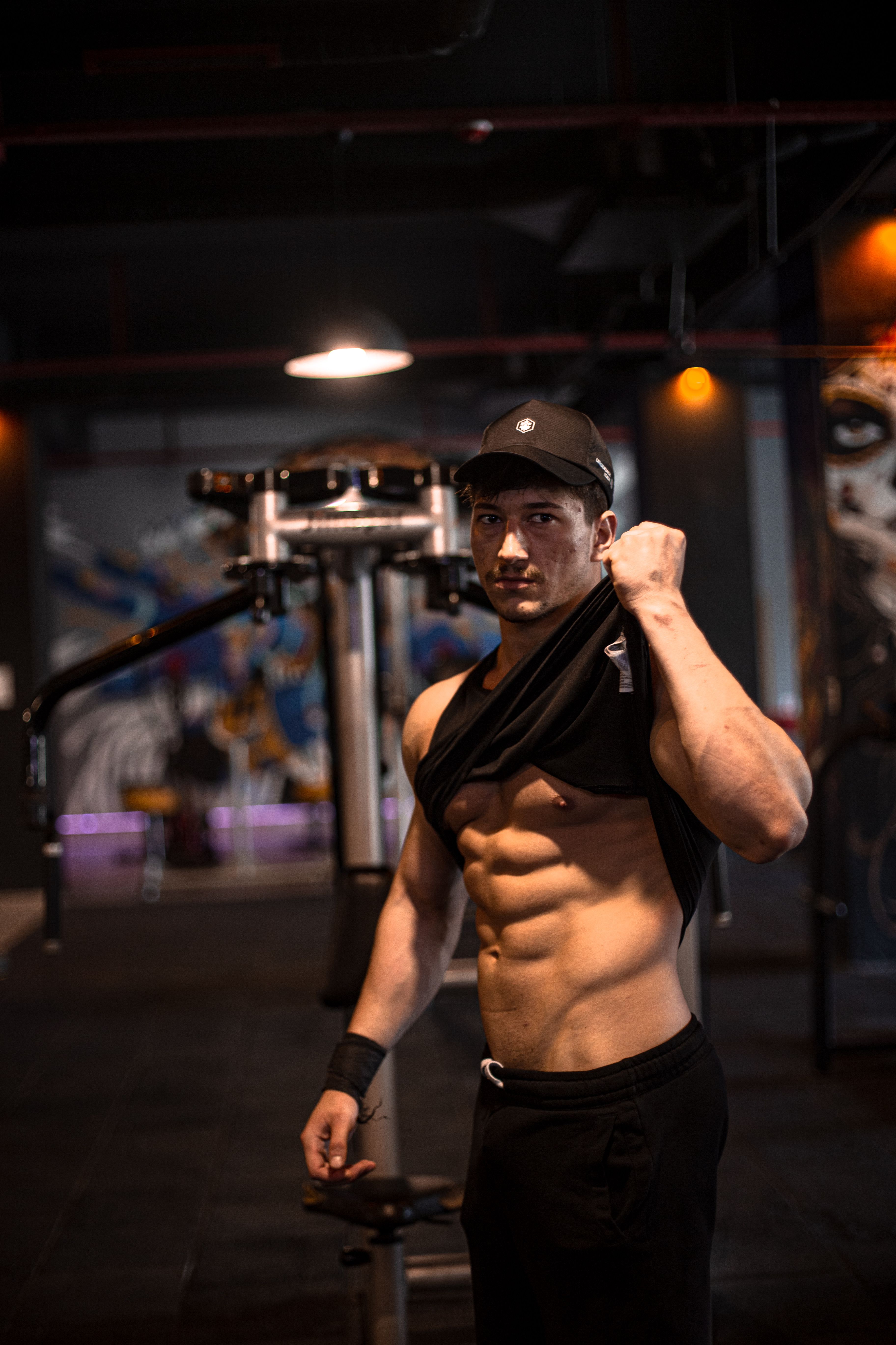 A Muscular Man Lifting His Shirt · Free Stock Photo
