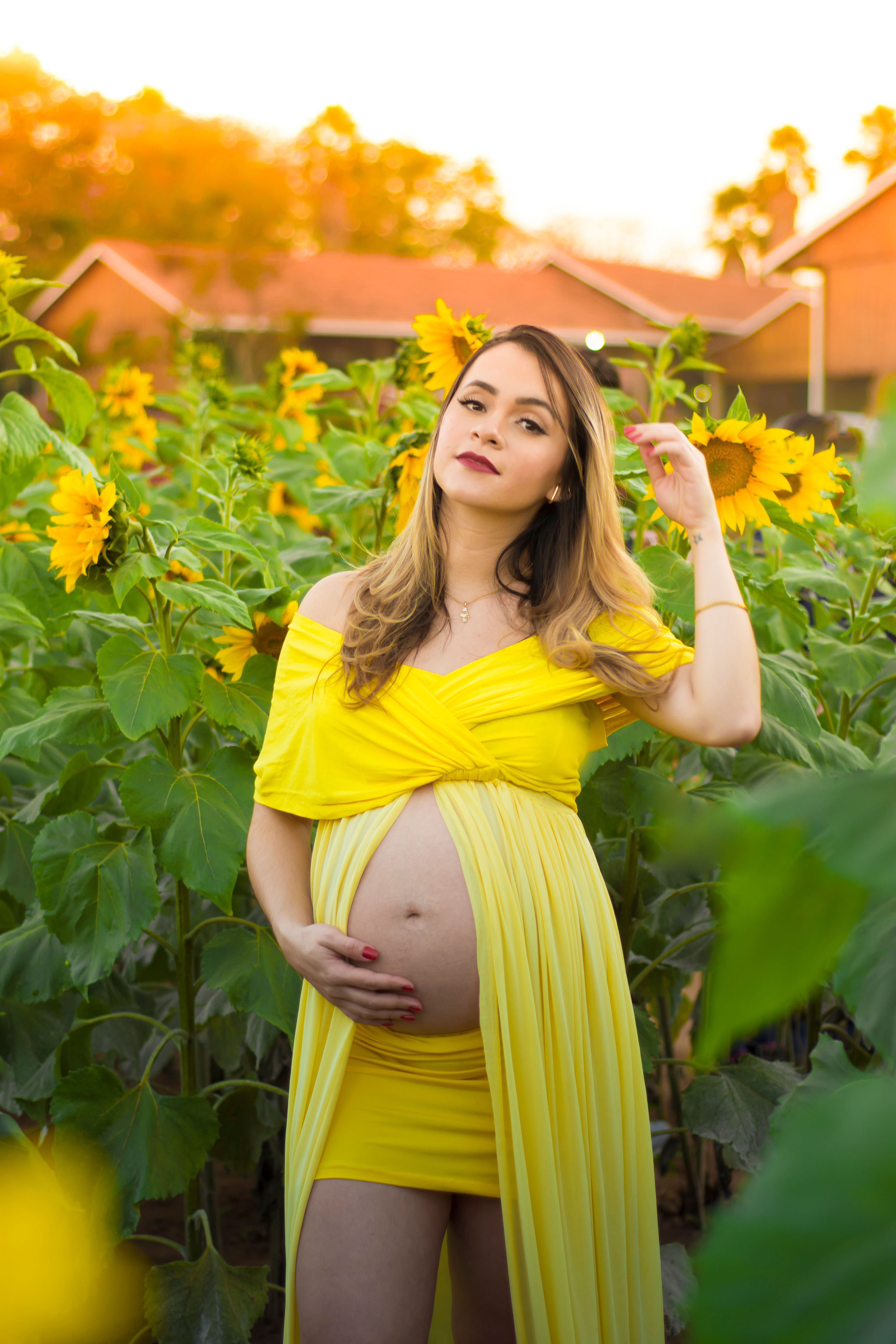 Pregnant Woman in a Blue Dress and a Tiara Posing in Studio · Free ...