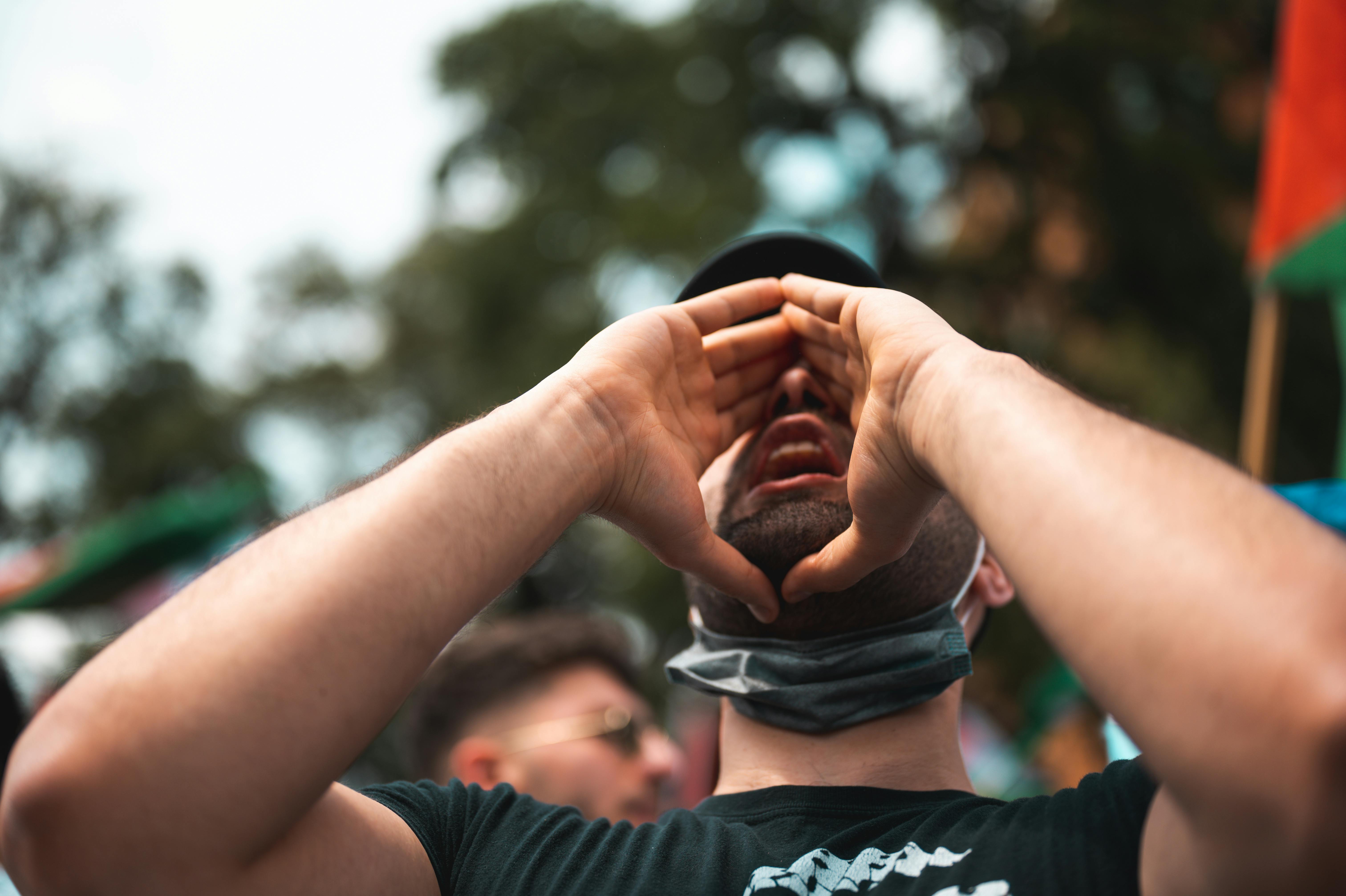 Woman Protesting Through a Megaphone · Free Stock Photo