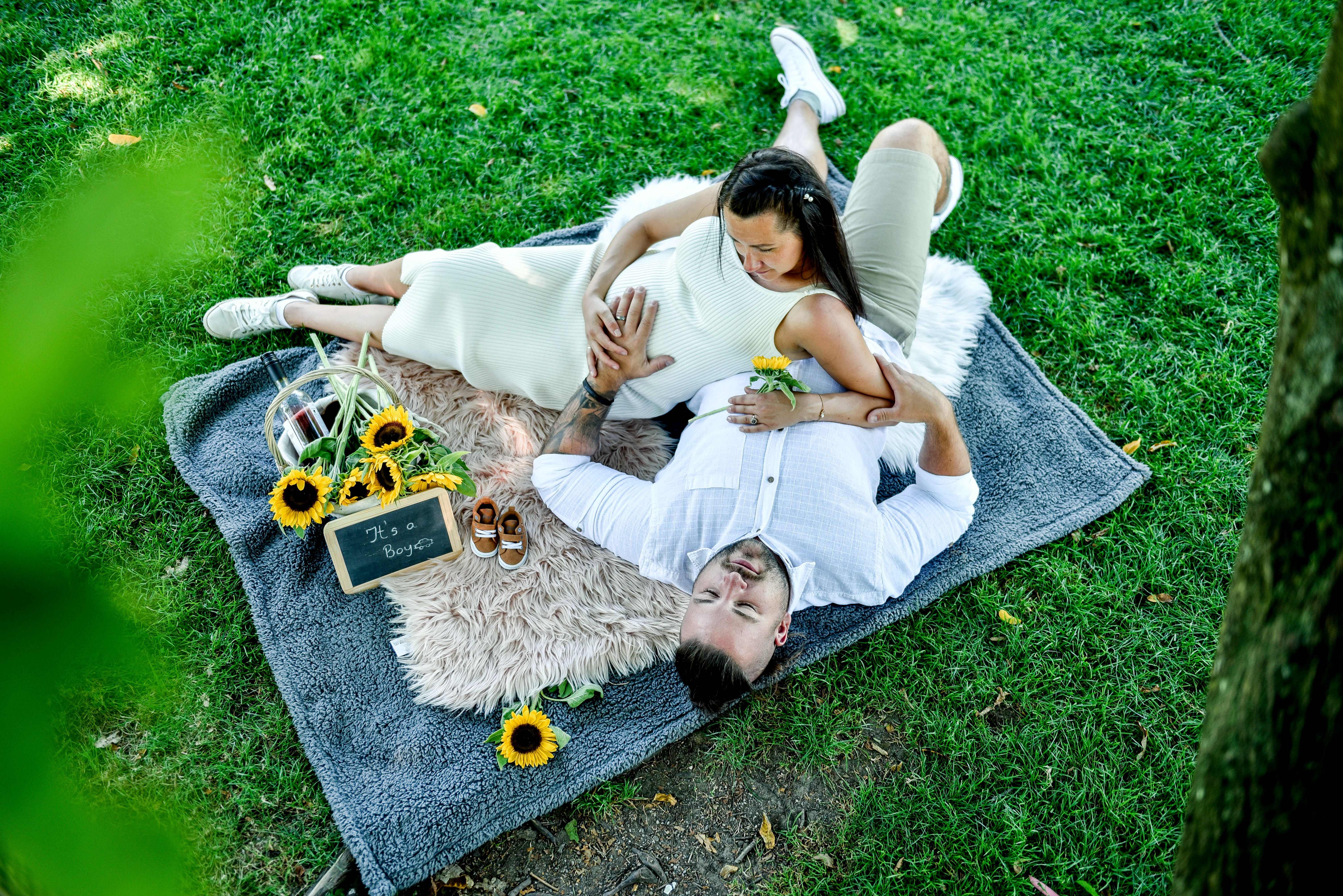 High-Angle Shot a Romantic Couple Lying on Picnic Blanket · Free Stock ...