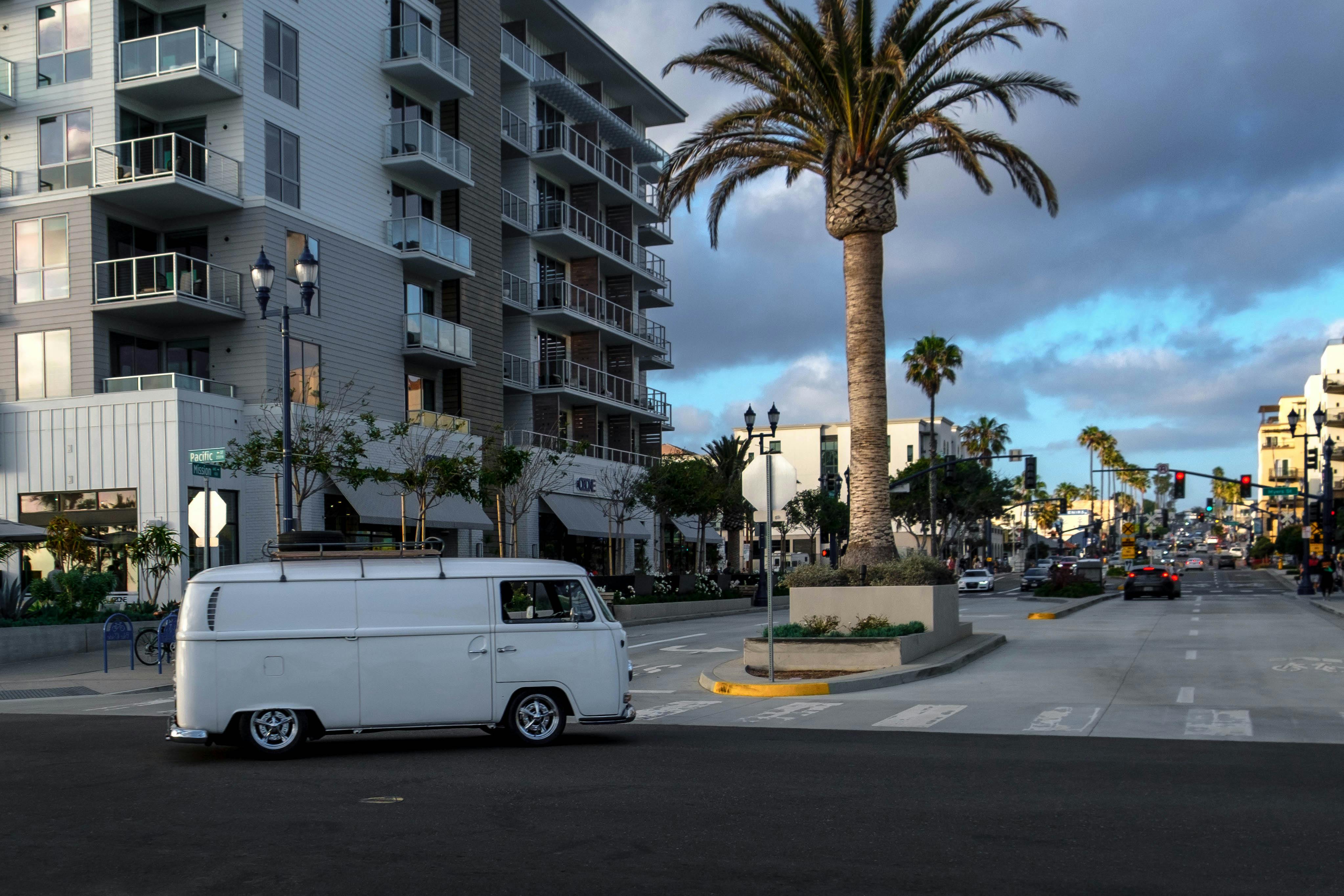 White Van on the Road Near Pedestrian Lane · Free Stock Photo